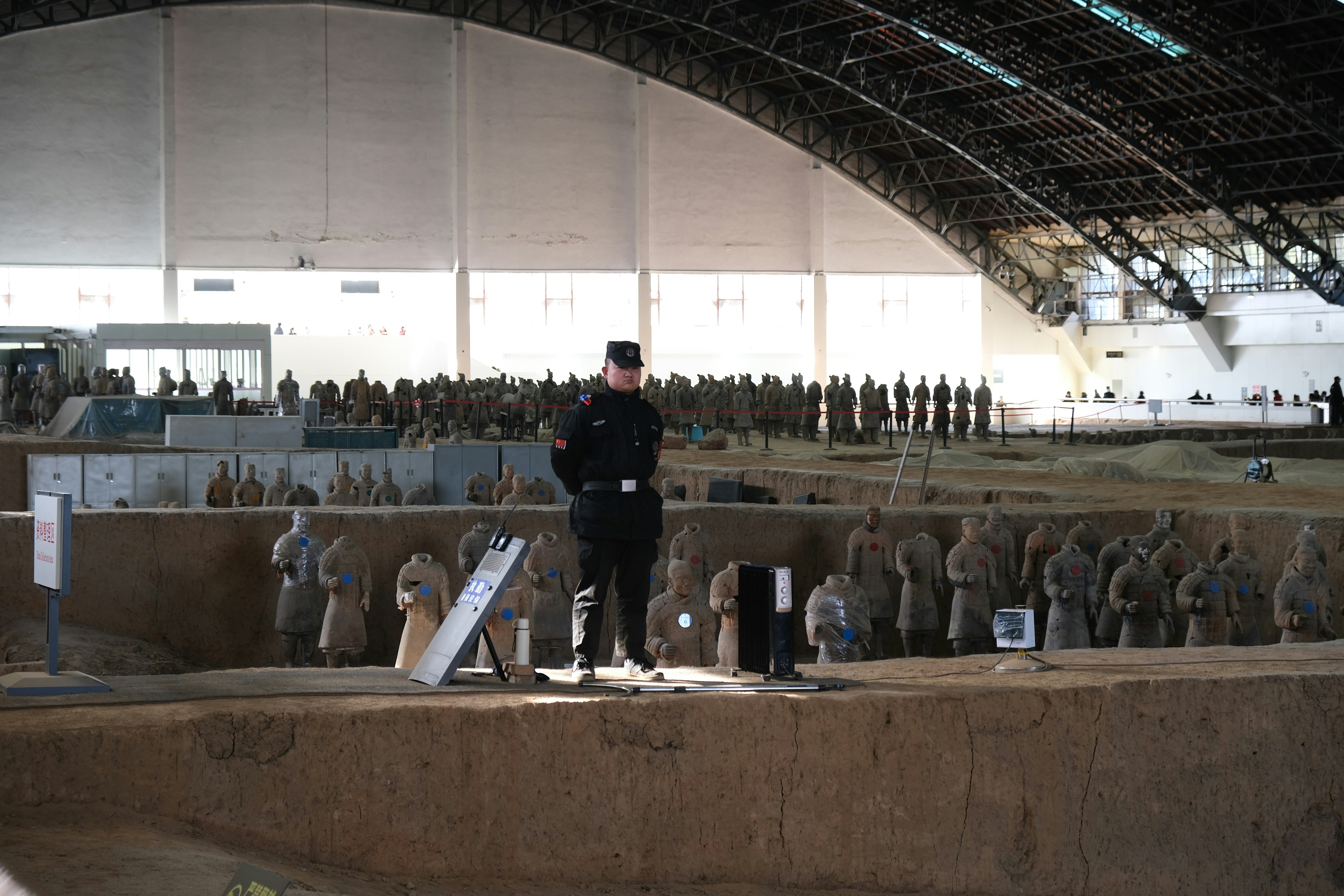 Uniformed Officer Under Spotlight in a Training Hall