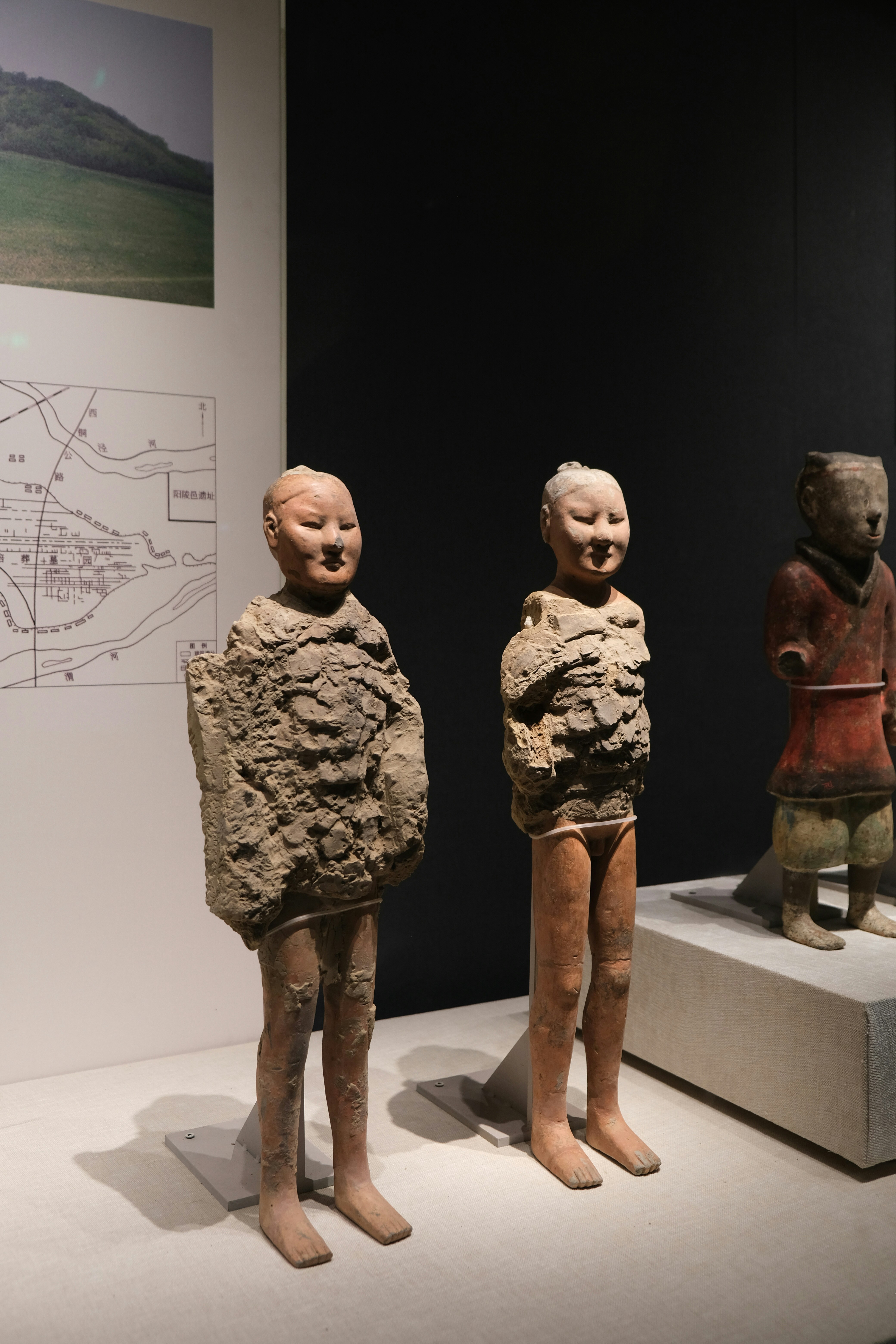 Echoes in Clay: Matched Pair of Eroded Figurines Stand as Silent Guides