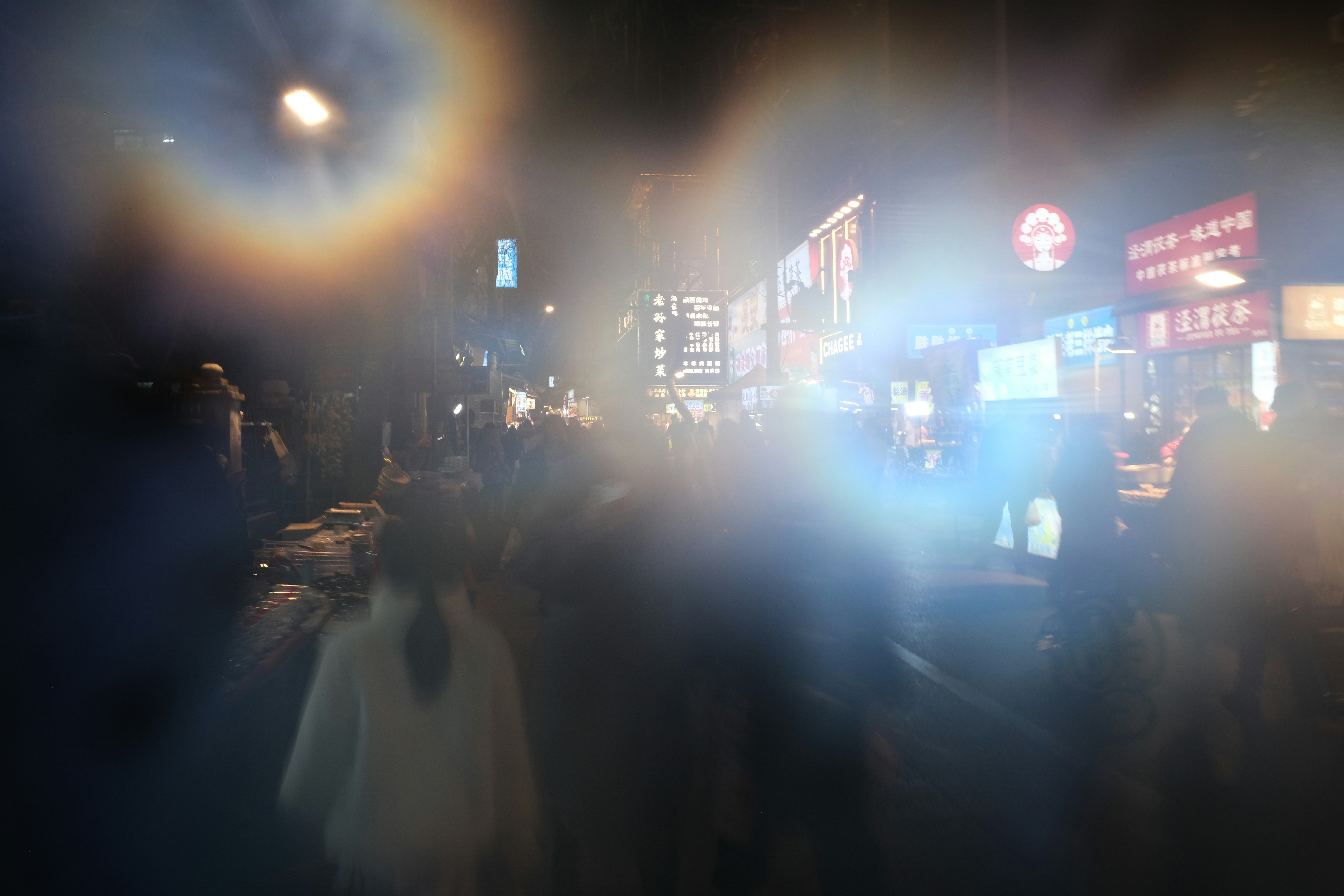 Neon fog: a bustling city night veiled in soft halos