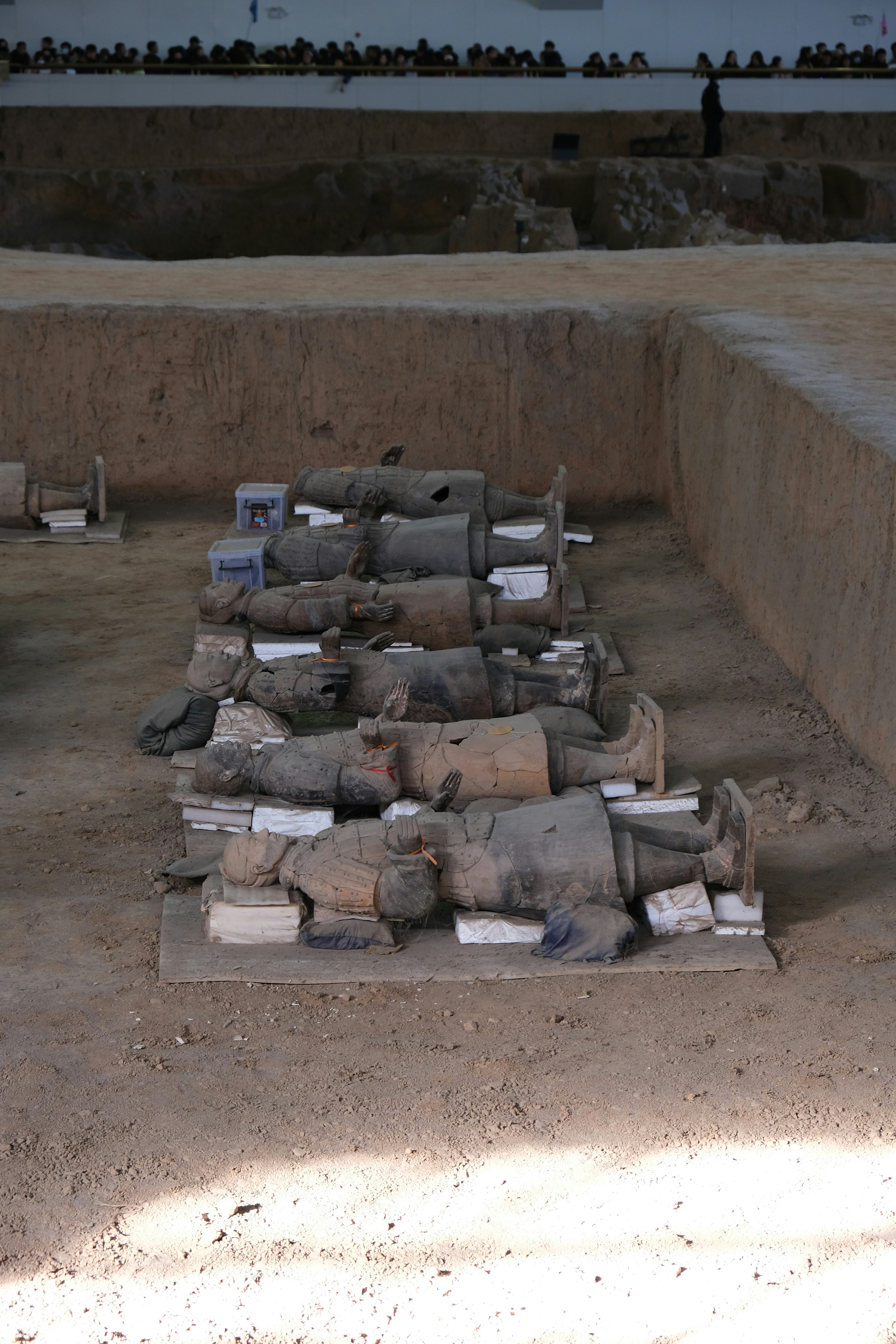 Rows of life-restoring bricks: a crypt-like display of recovered bodies in an archaeological pit