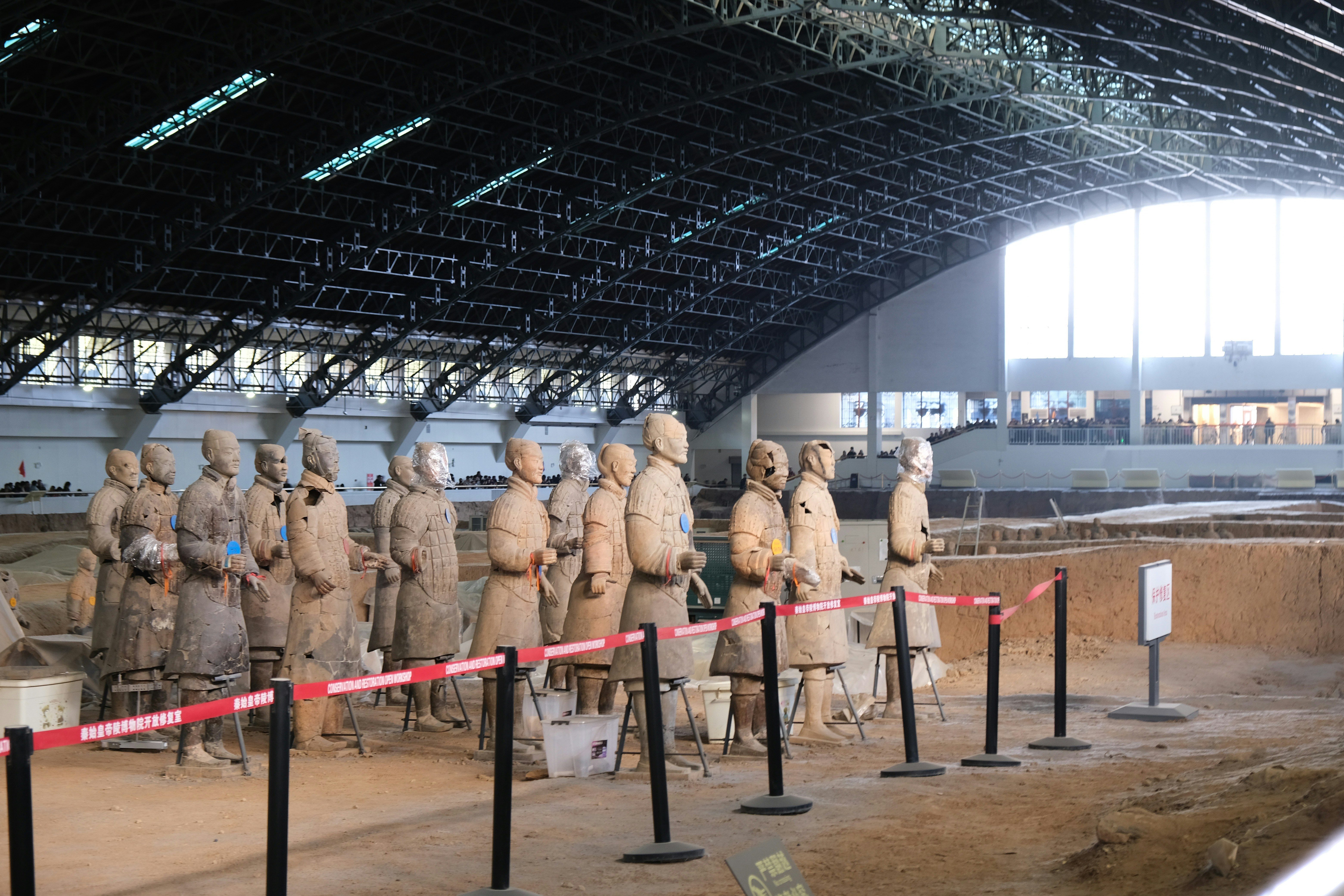 Row of Silent Apprentices in a Dusty Exhibition Hall