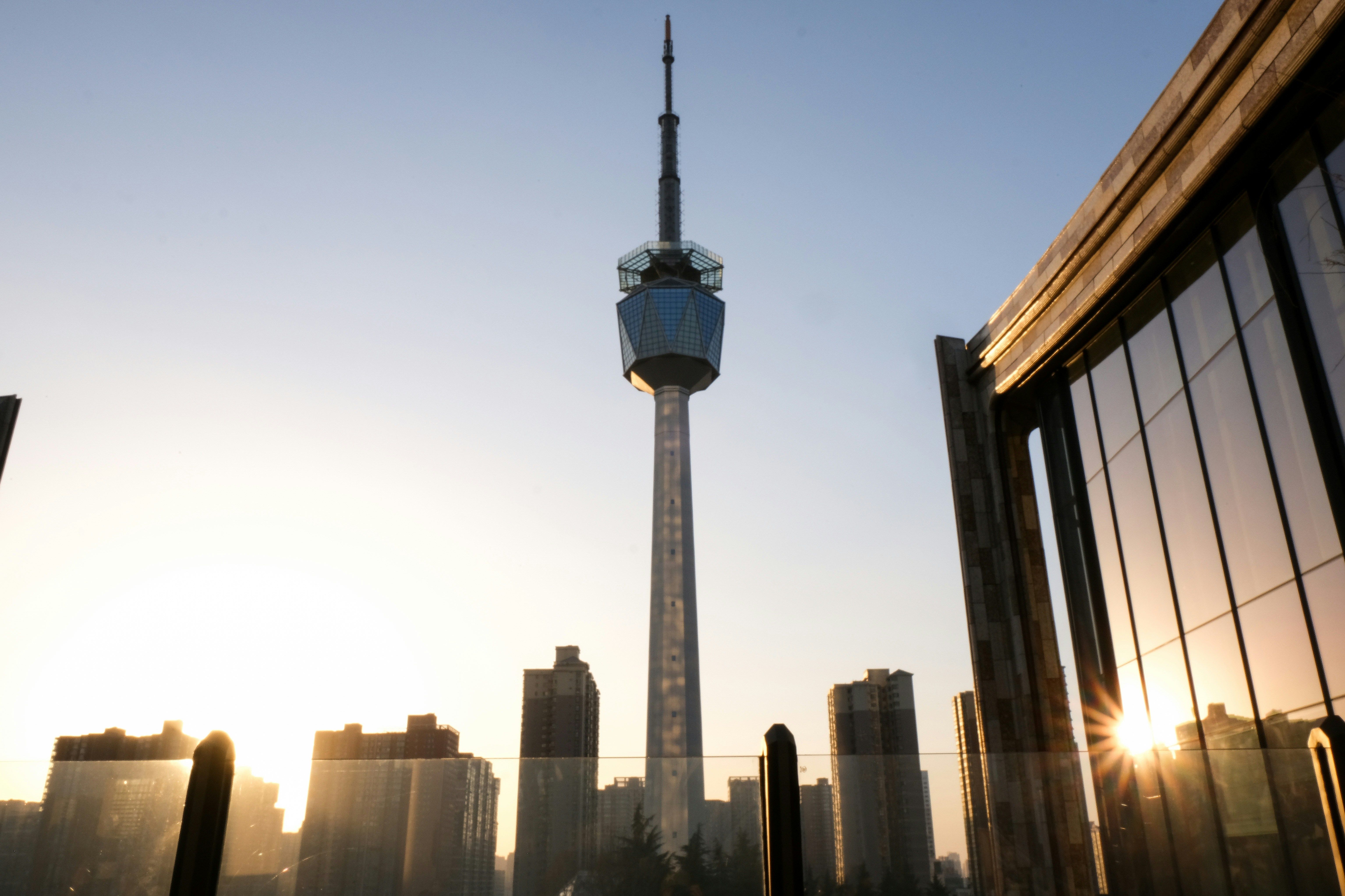 Crown of the City: Sunlit Tower Against a Painted Skyline