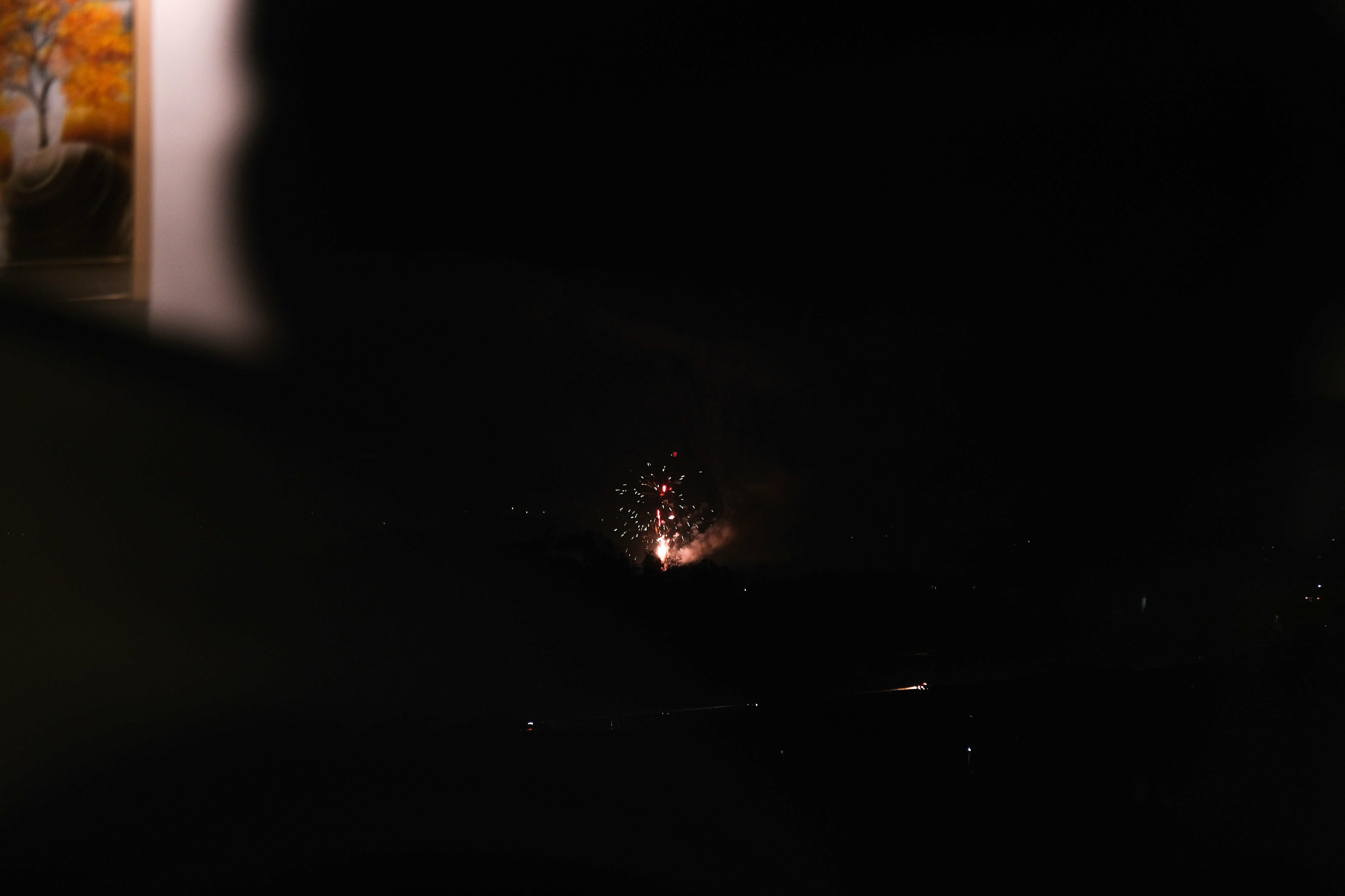 Midnight Sparks: A Narrow View into a Quiet Firework Moment