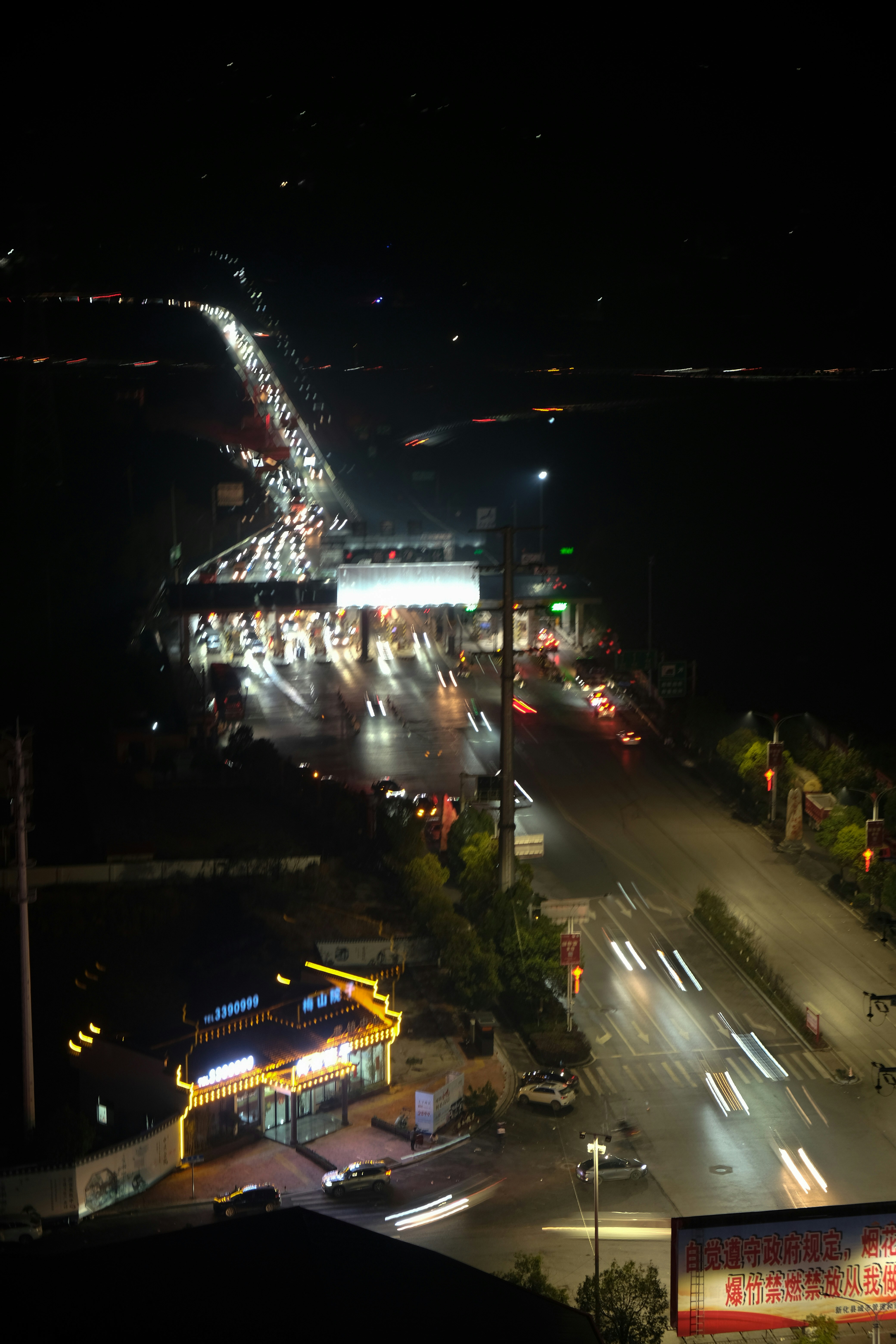 Night Neon Trace: A Tilt-Shift Street Scene Down a Blurred Highway