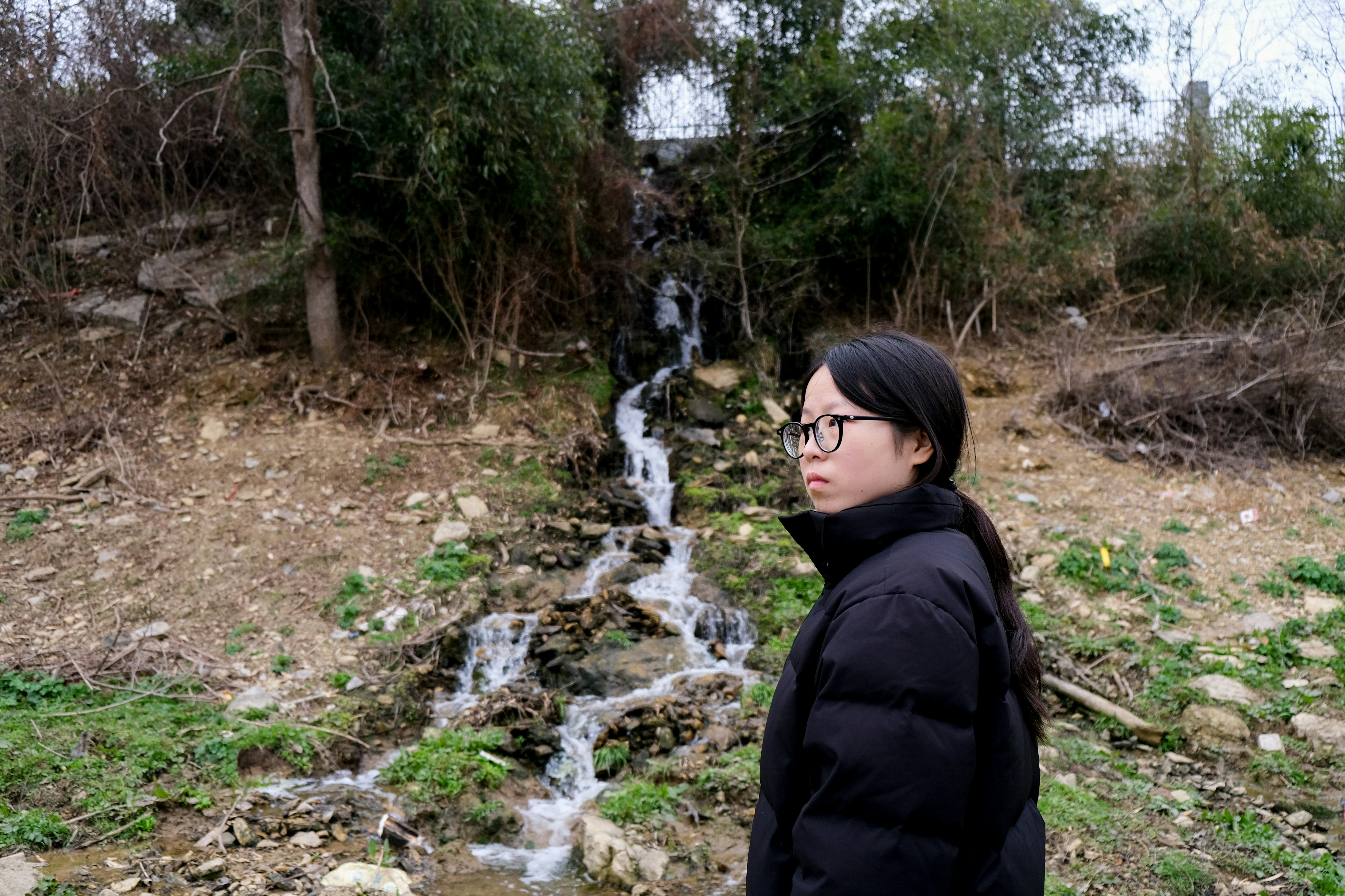 Quiet Portrait by a Forested Cascade