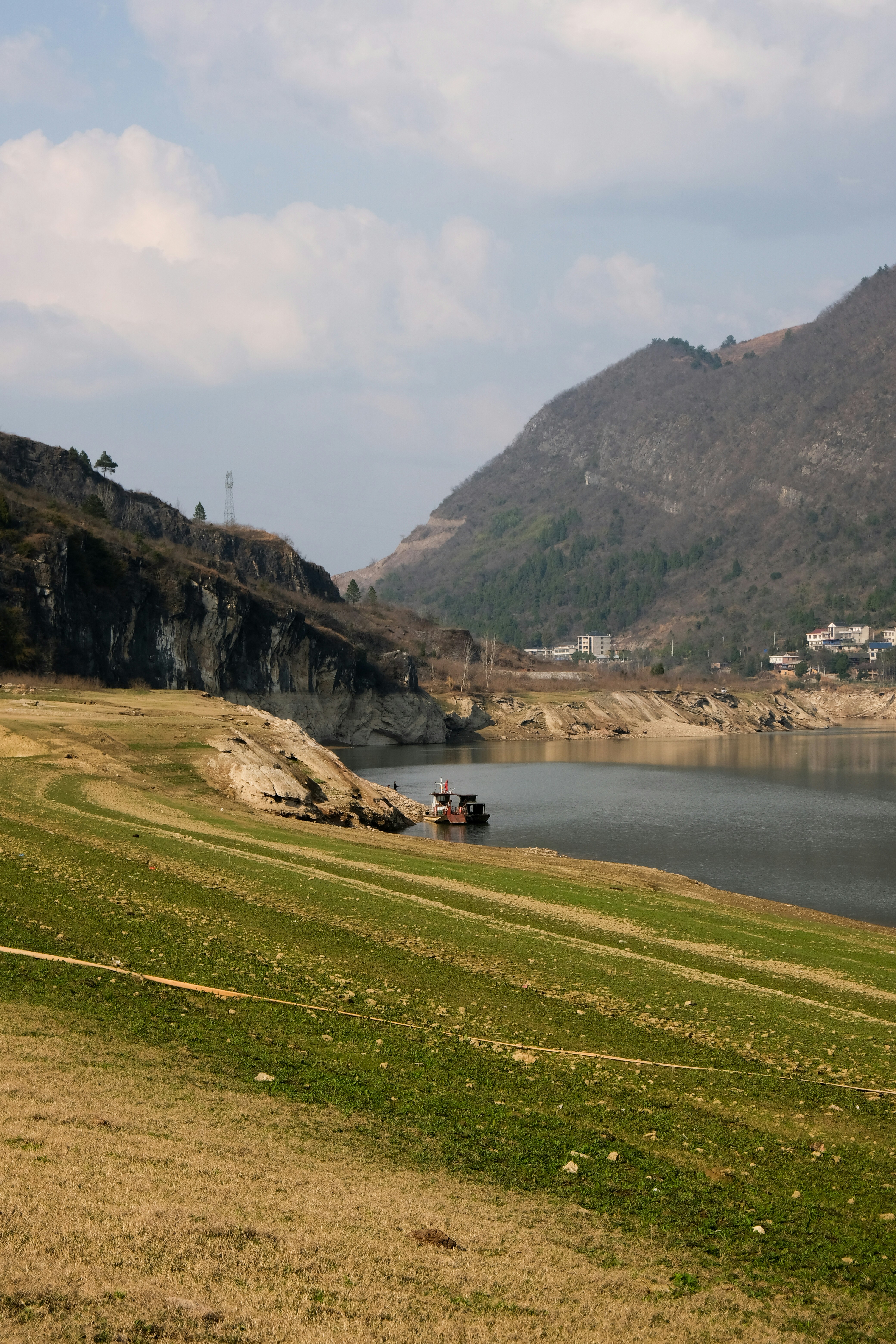 Riverbank Panorama with Terraced Hills