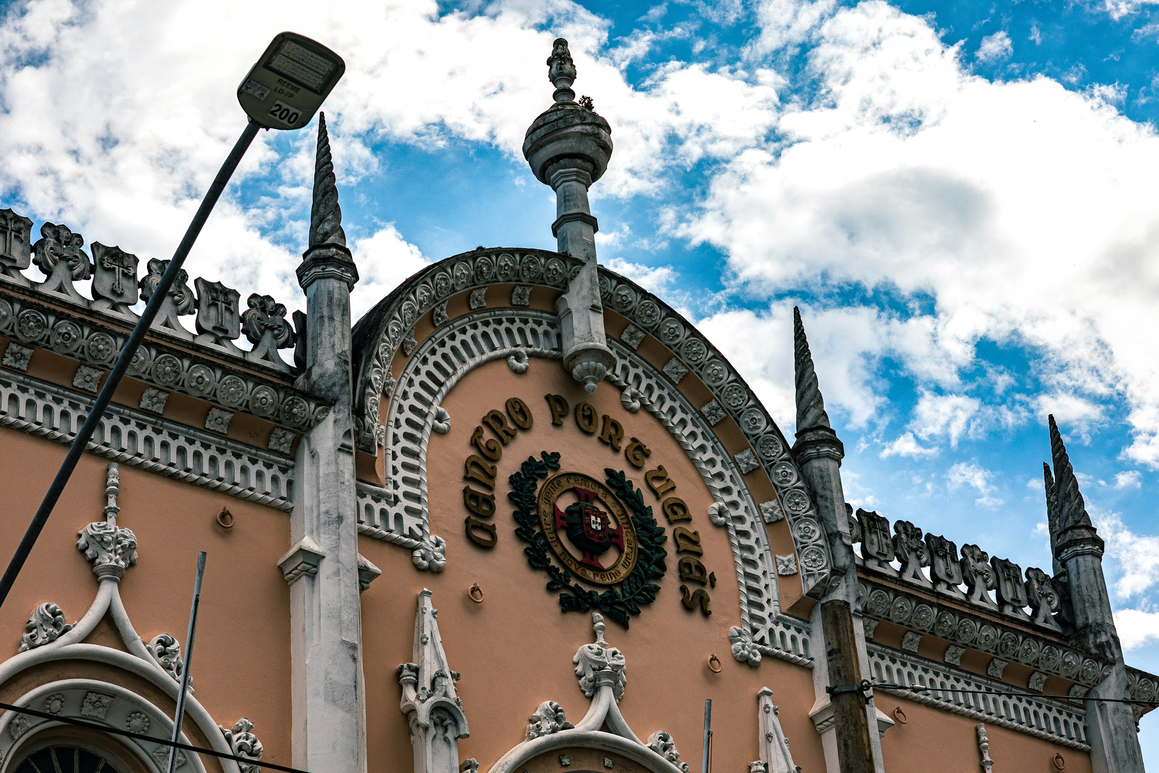 Ornate Facade of a Vintage Theater with Decorative Pillars