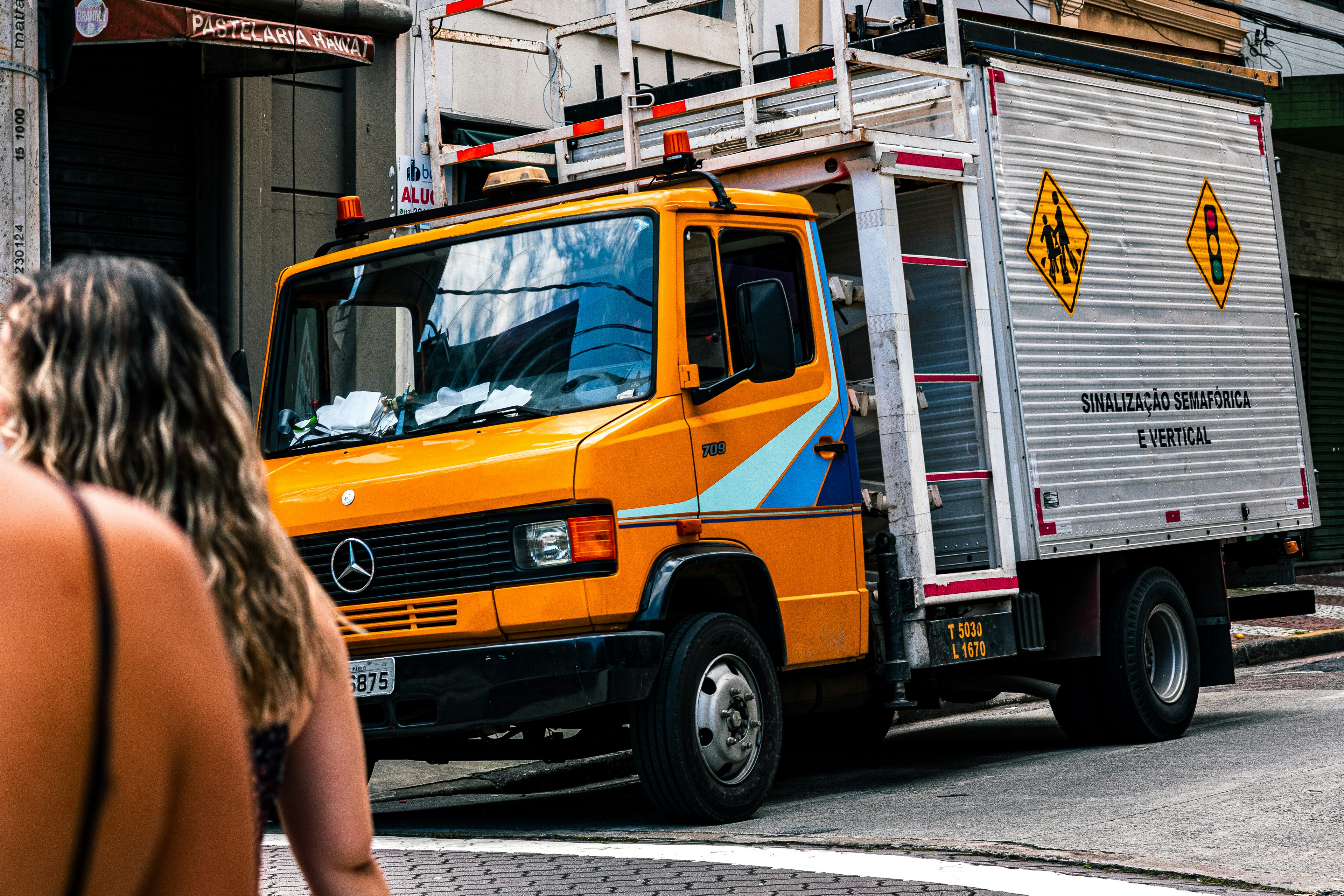 Orange Delivery Truck Skewed Street Scene