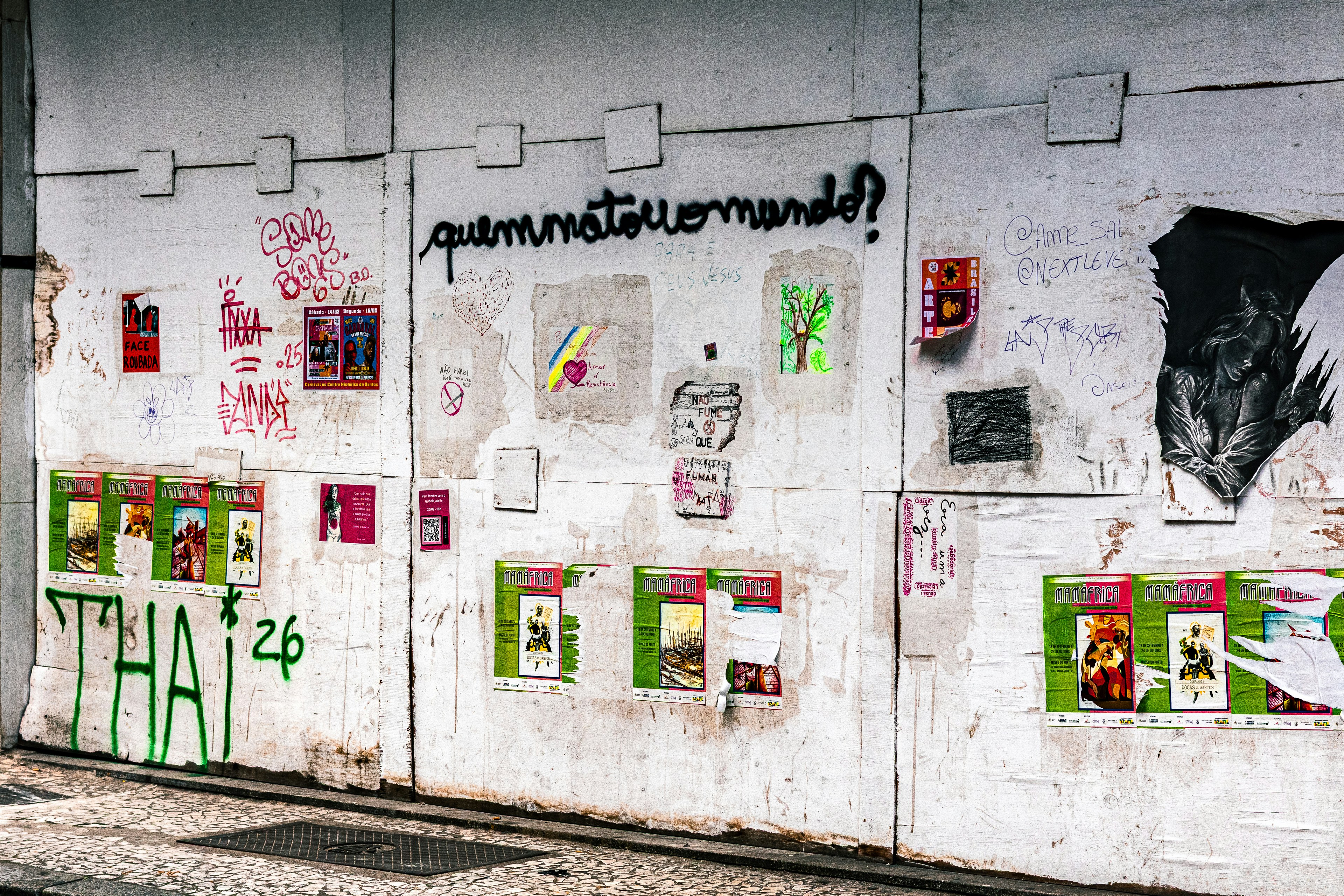 Graffiti and posters adorn a textured concrete wall. photo – Free Black ...
