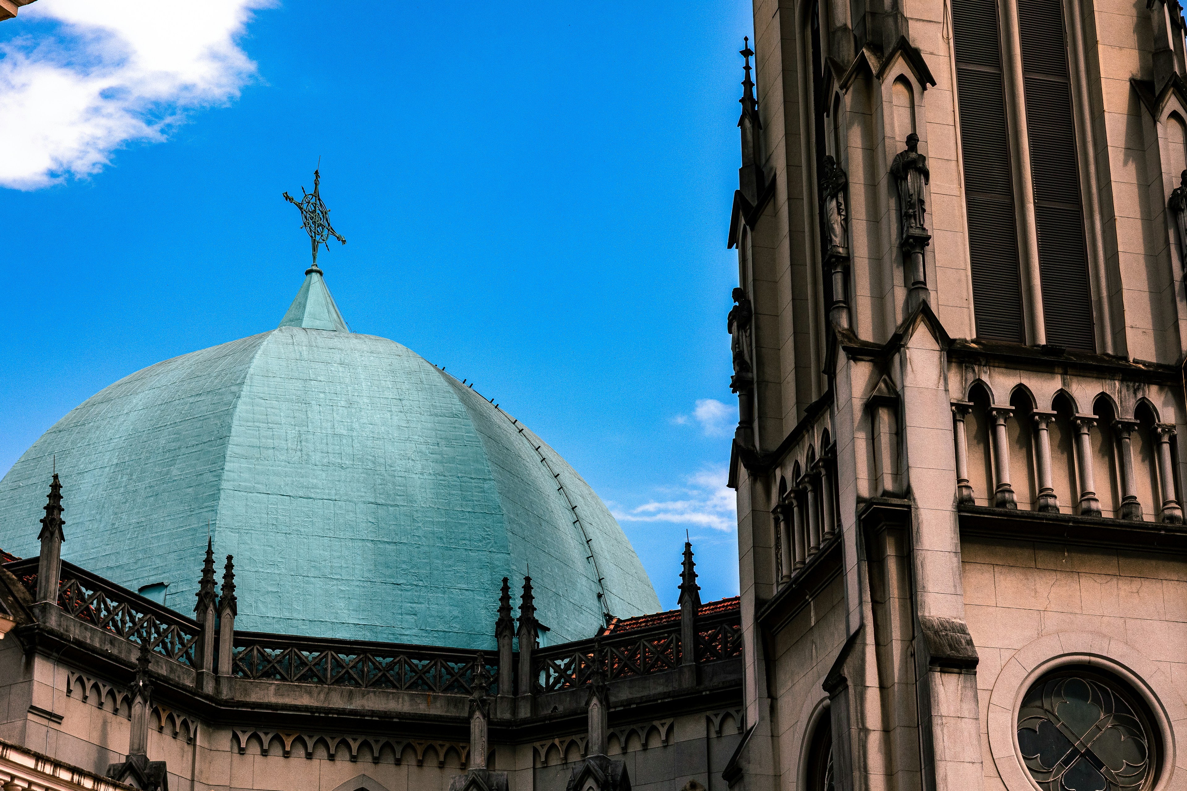 Dome and Gothic Facade under a Clear Blue Sky