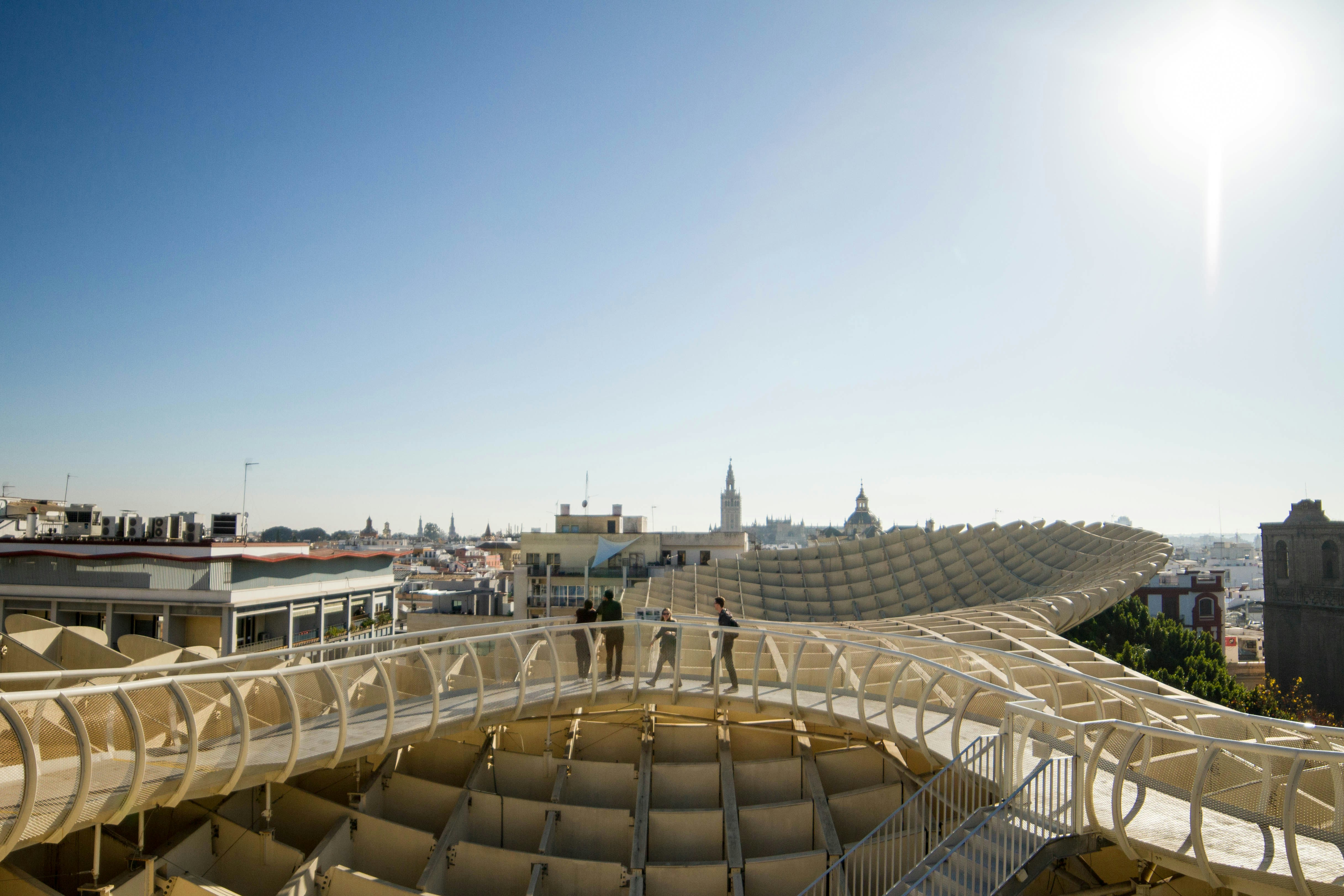 Sunlit skyline and serpentine rooflines at Park Guell inspired overlook