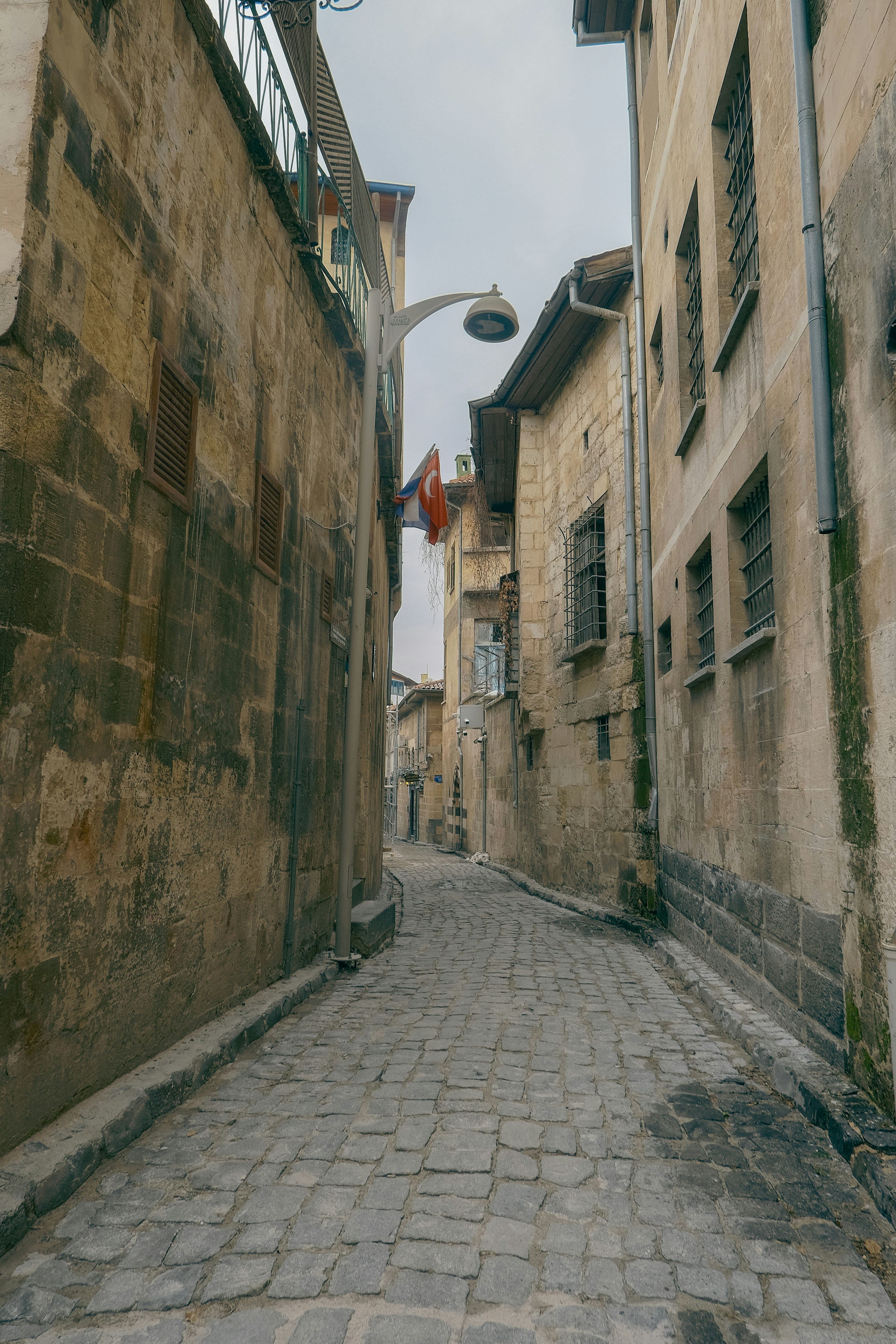 Cobblestone Alleyways: A Quiet Passage Between Stone Facades