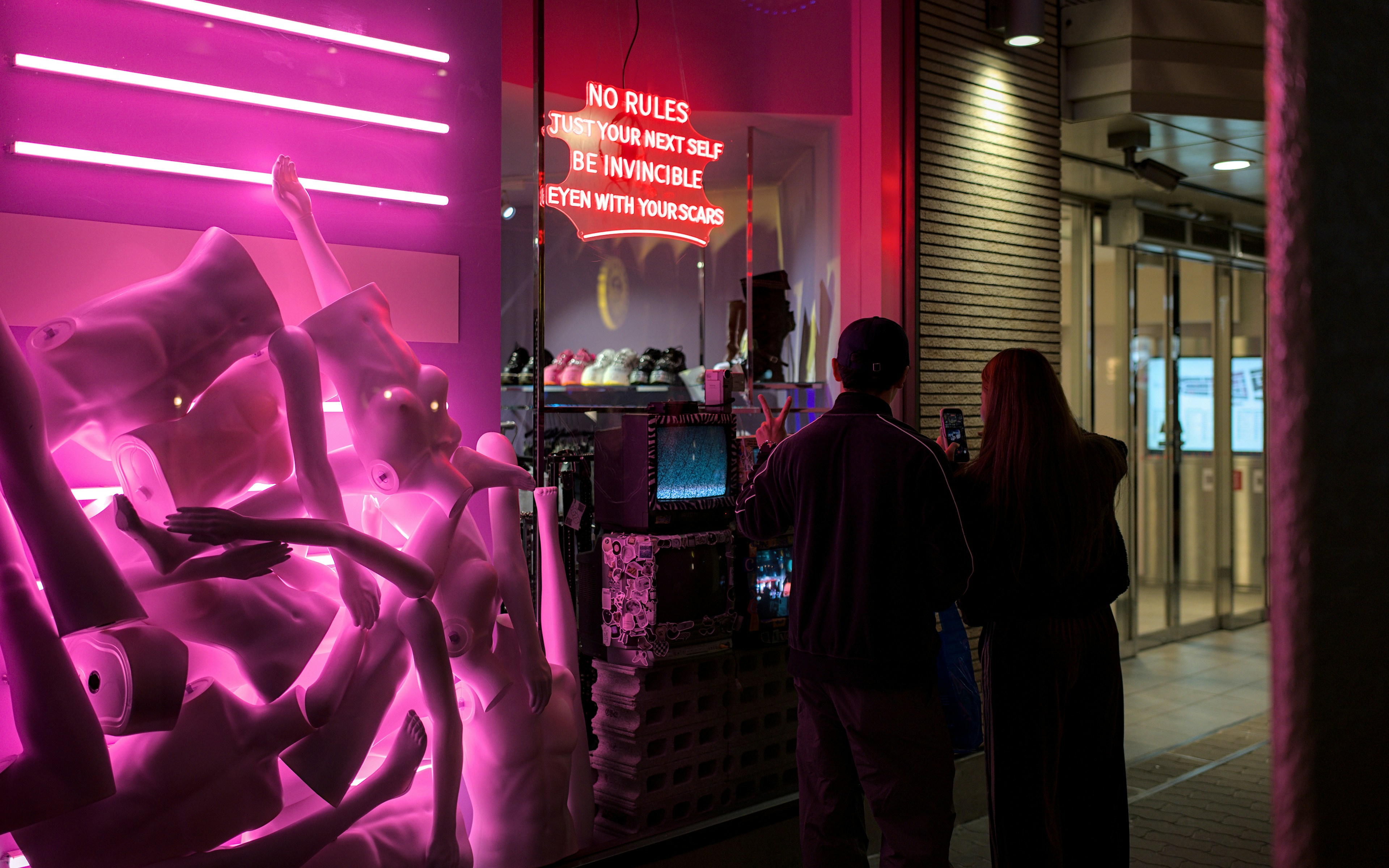 Neon Reflections Outside a Nightstore