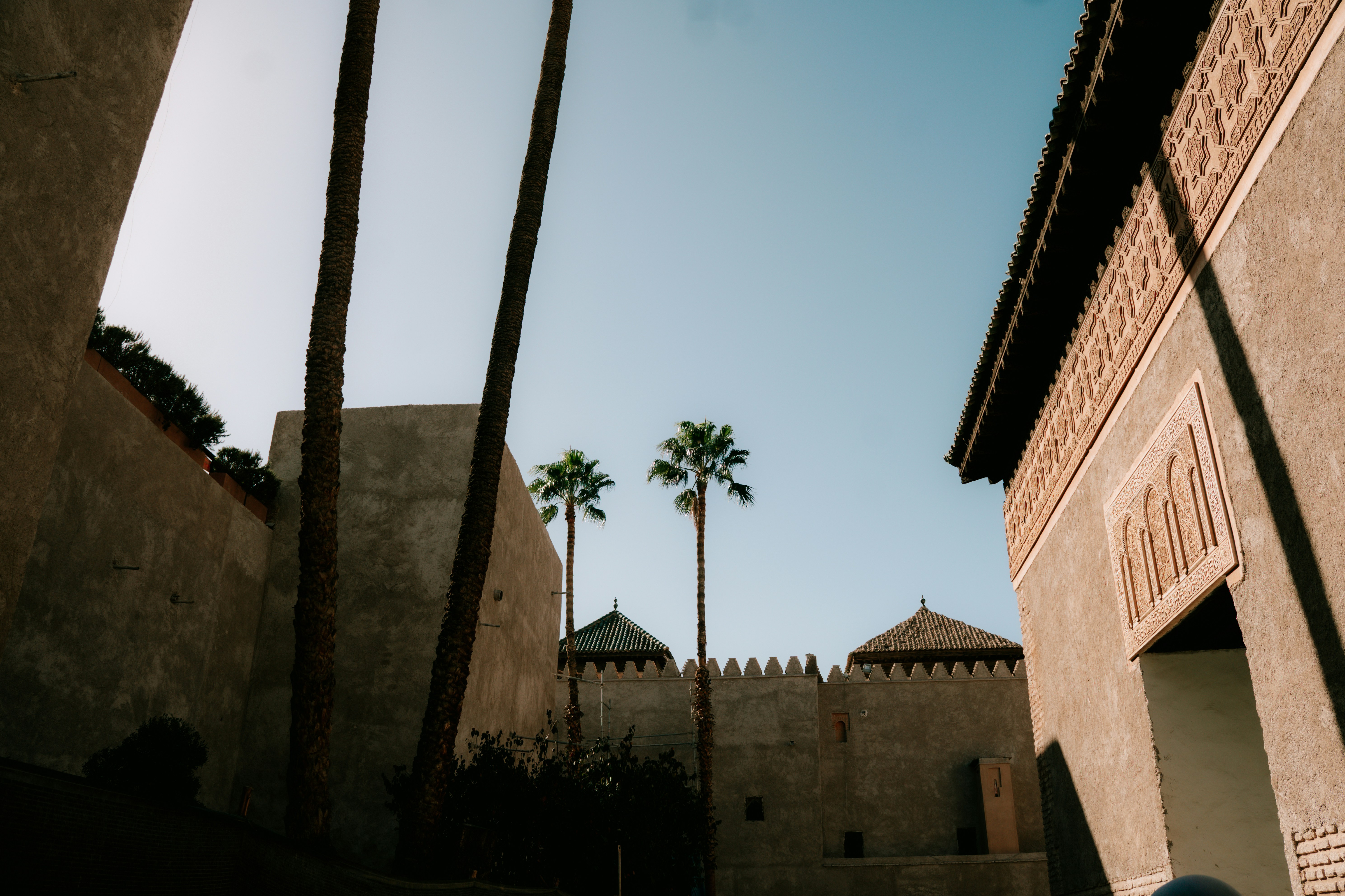 Courtyard of Shadows: Palm Arches and Stone Facades