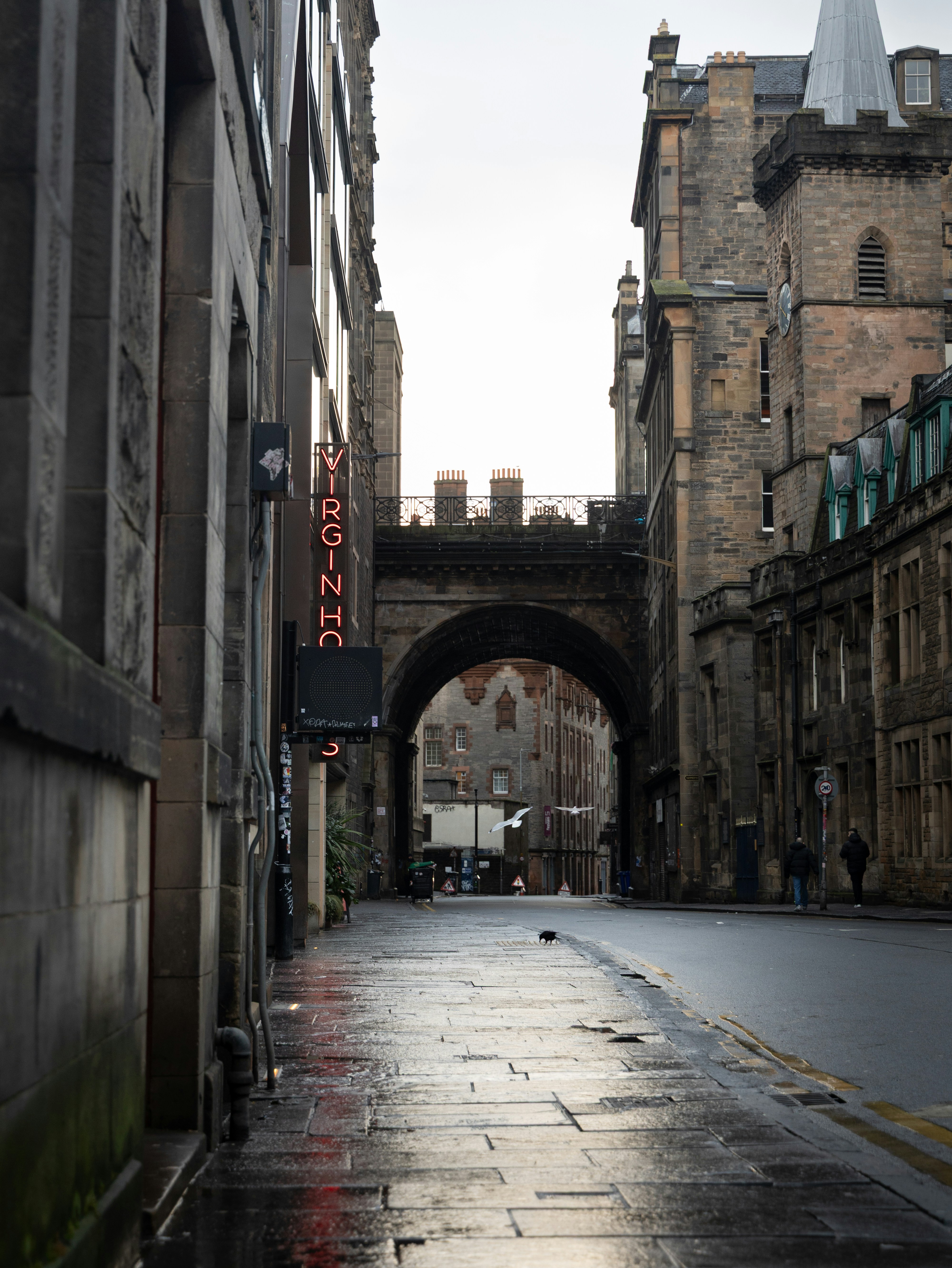 Archway Over Cobbled Street: A Quiet City Corridor
