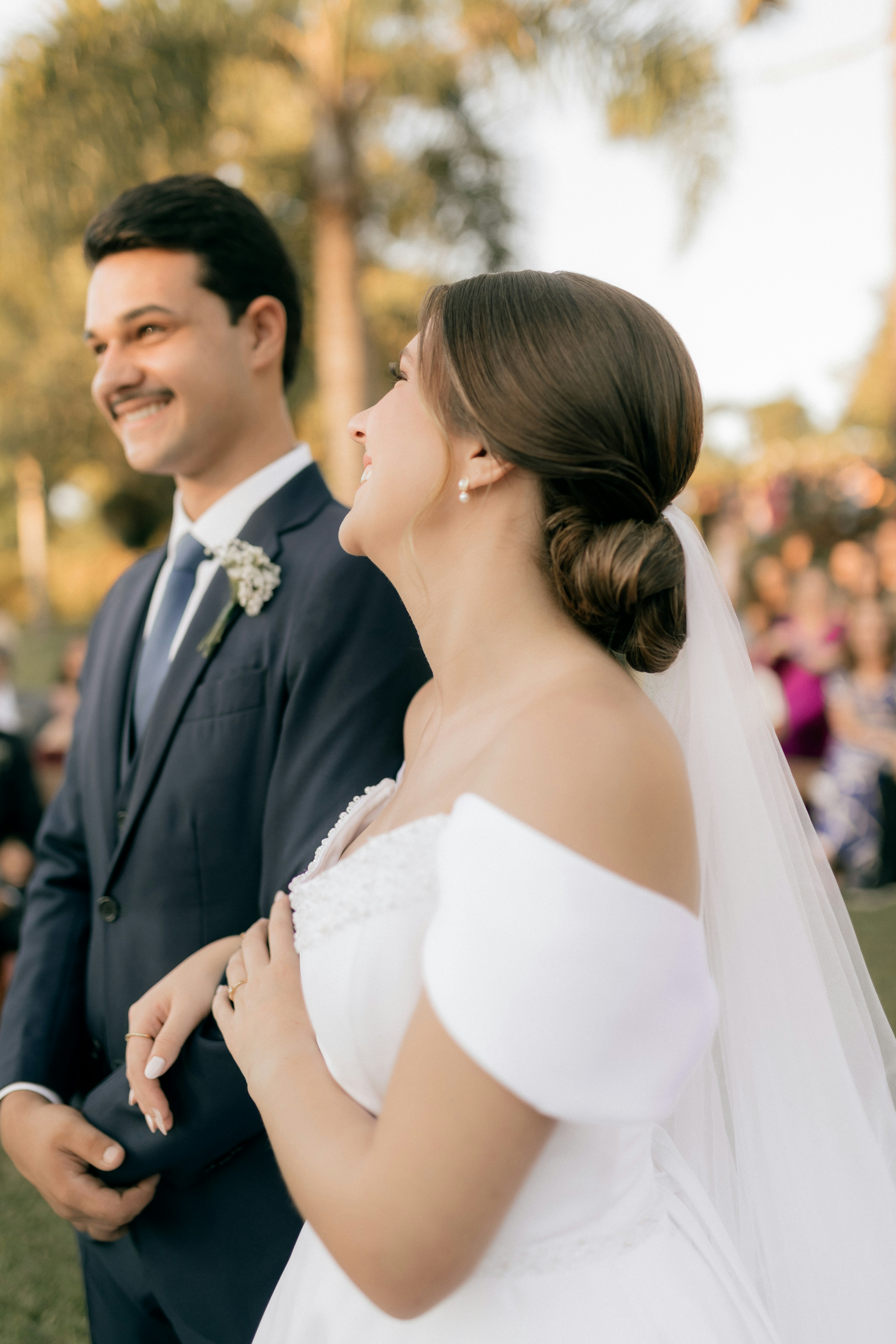 Veil of Joy: A Bride and Groom Share a Gentle Moment
