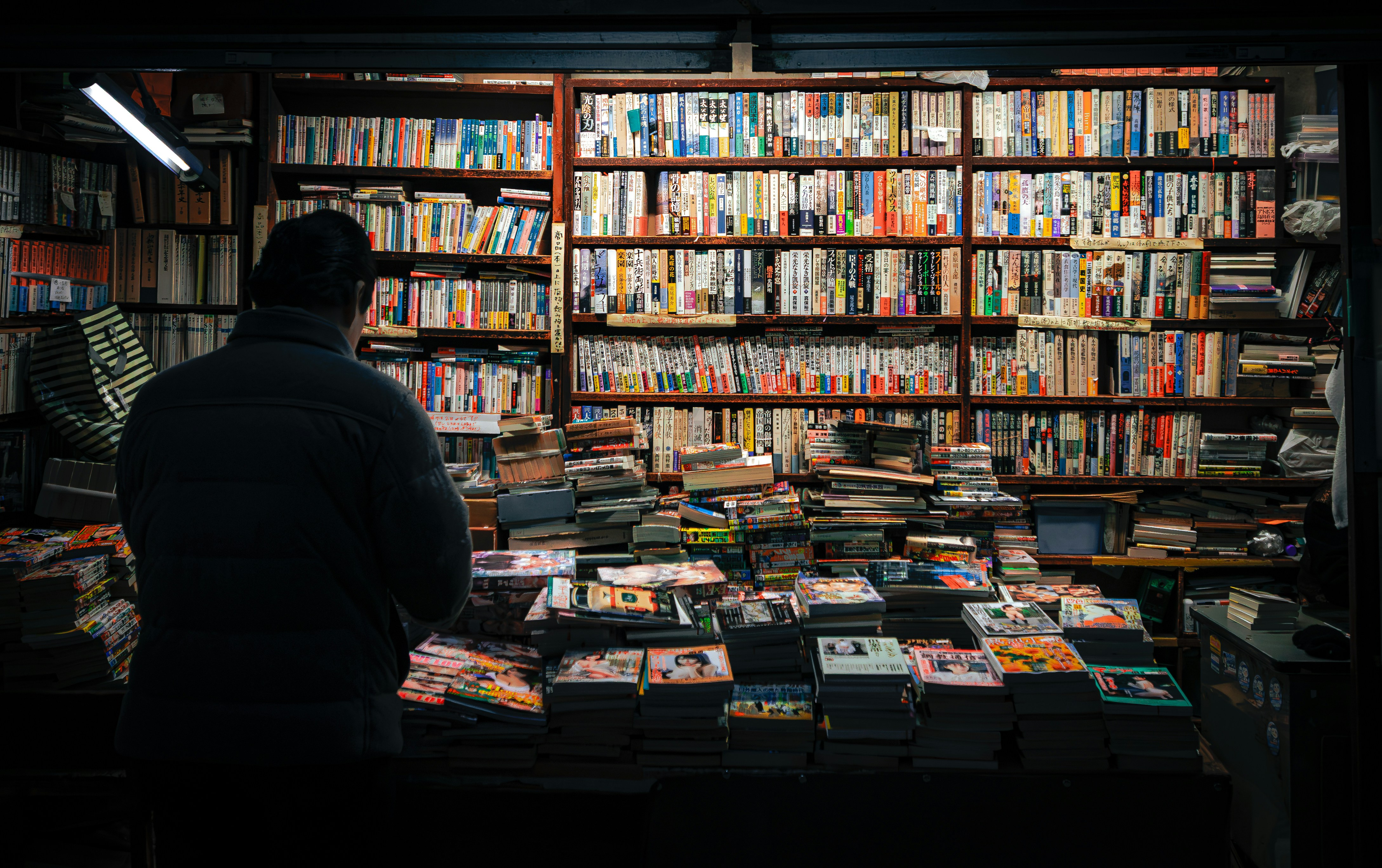 Bookseller in a Quiet Alley of Stacks