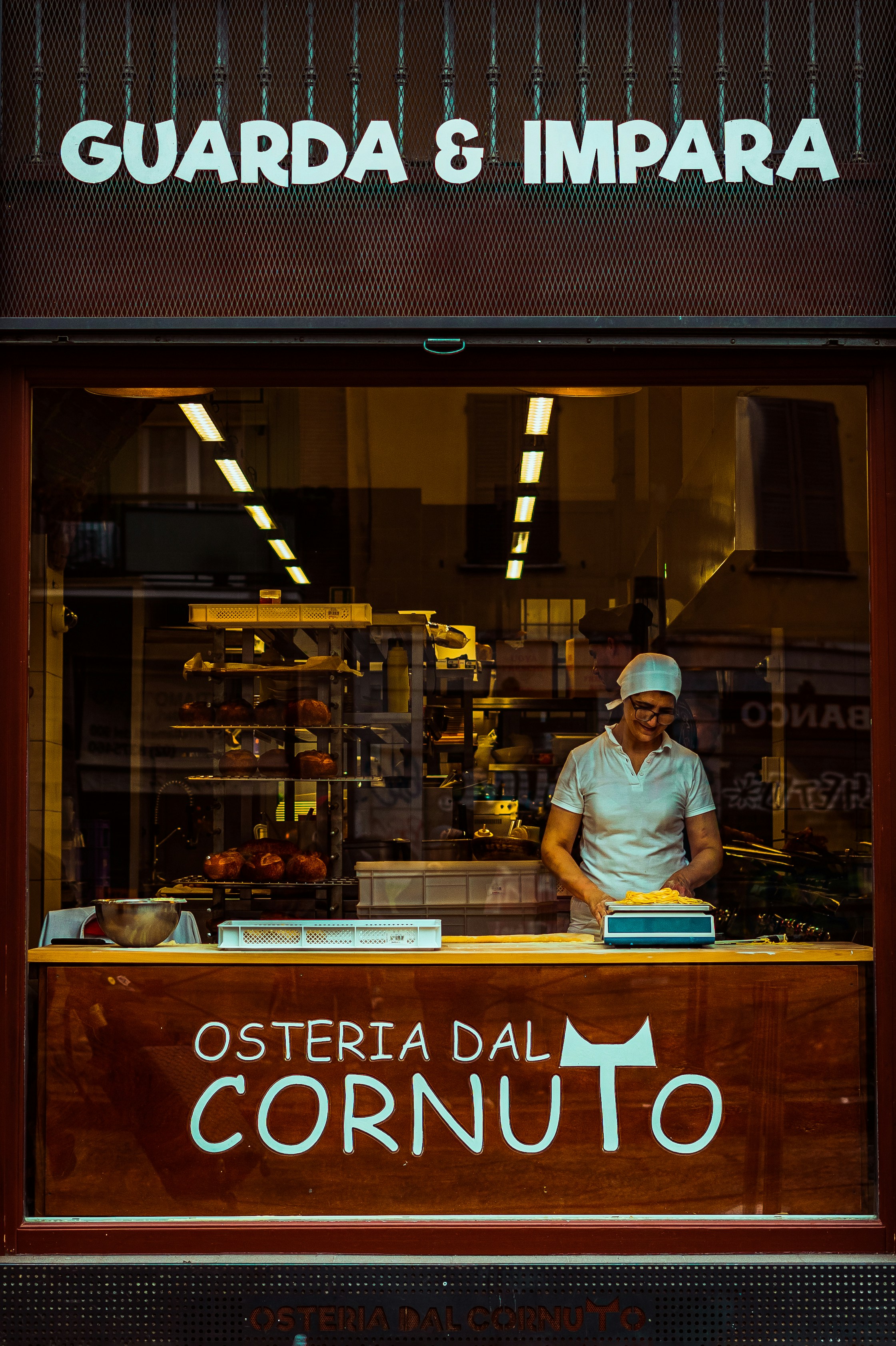 Shopkeeper at the Window: A Quiet Craft of Cornuto