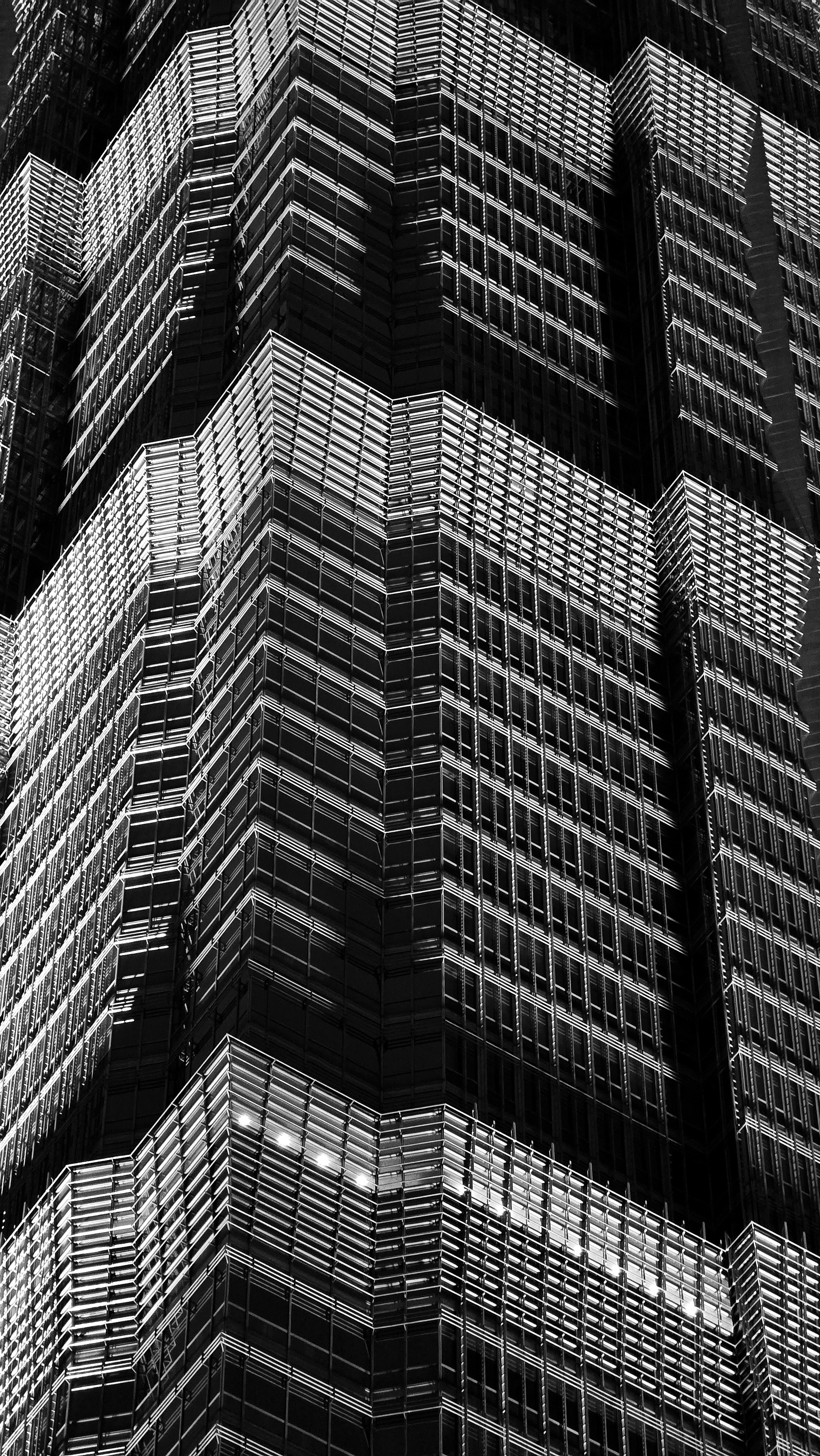 Layered Glass: A Tiled Facade Weave of Shadows