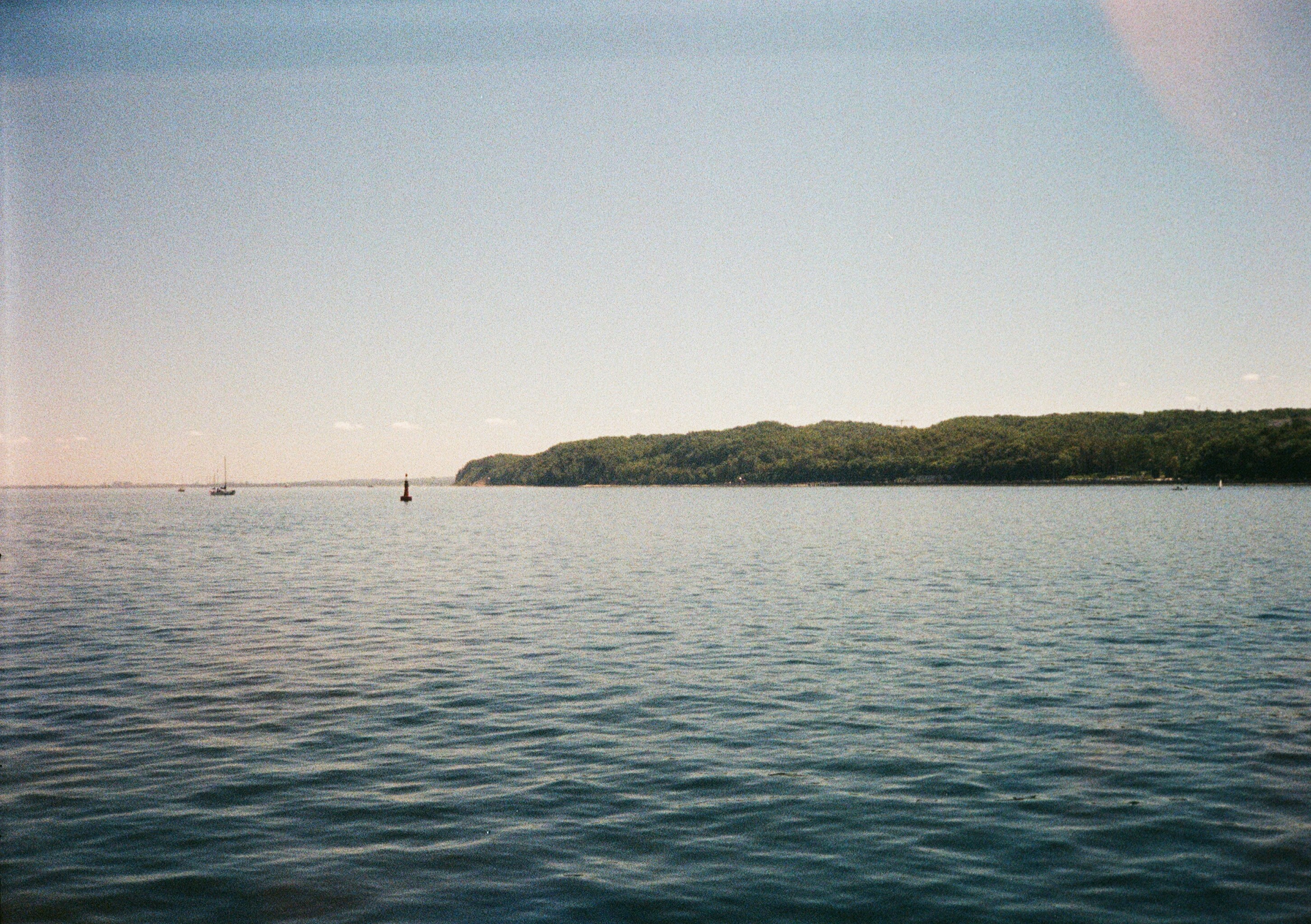Calm Horizon: A Waterfront Vista Under Open Sky