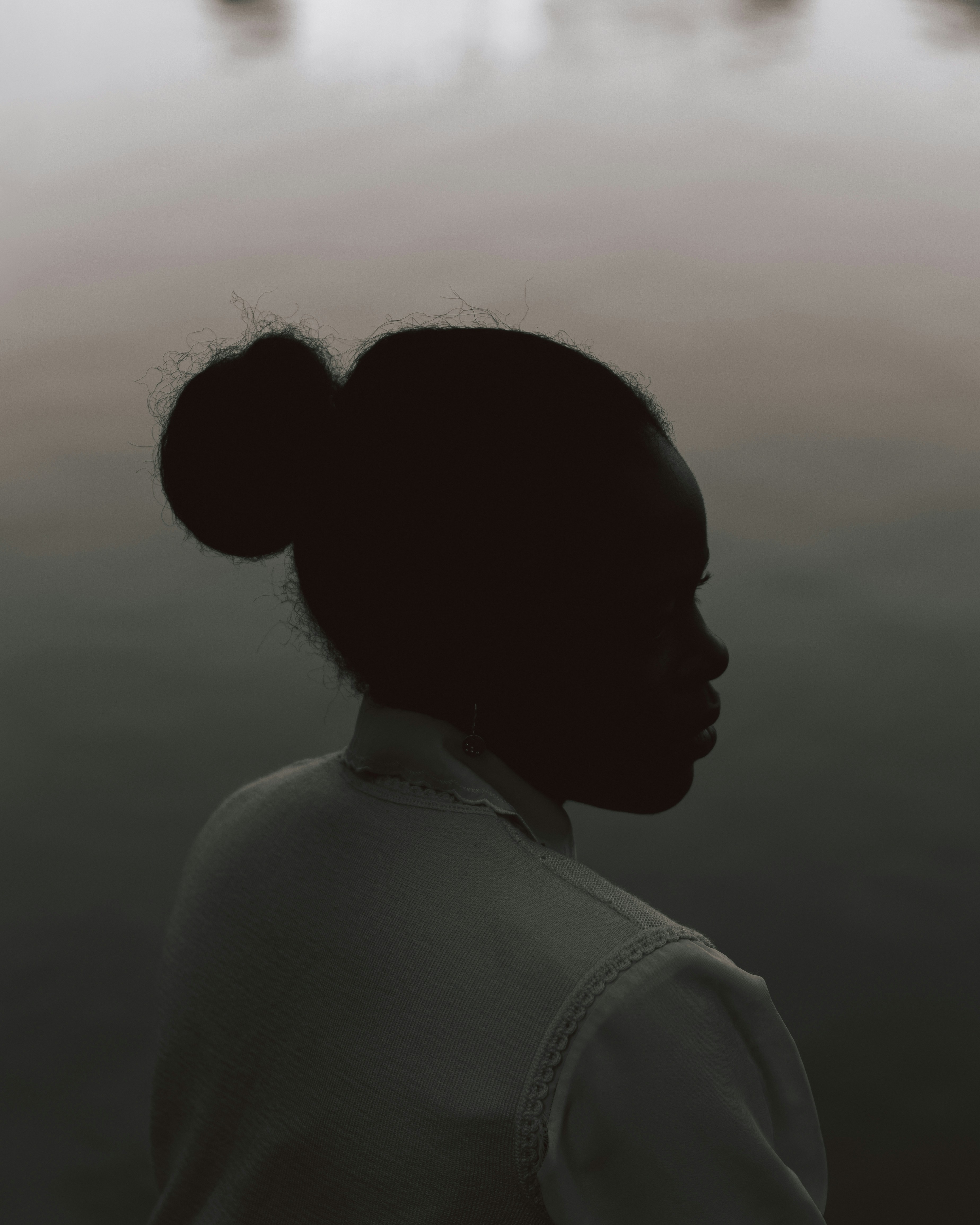 Silhouette by the Shore: Quiet Contemplation in Dusk