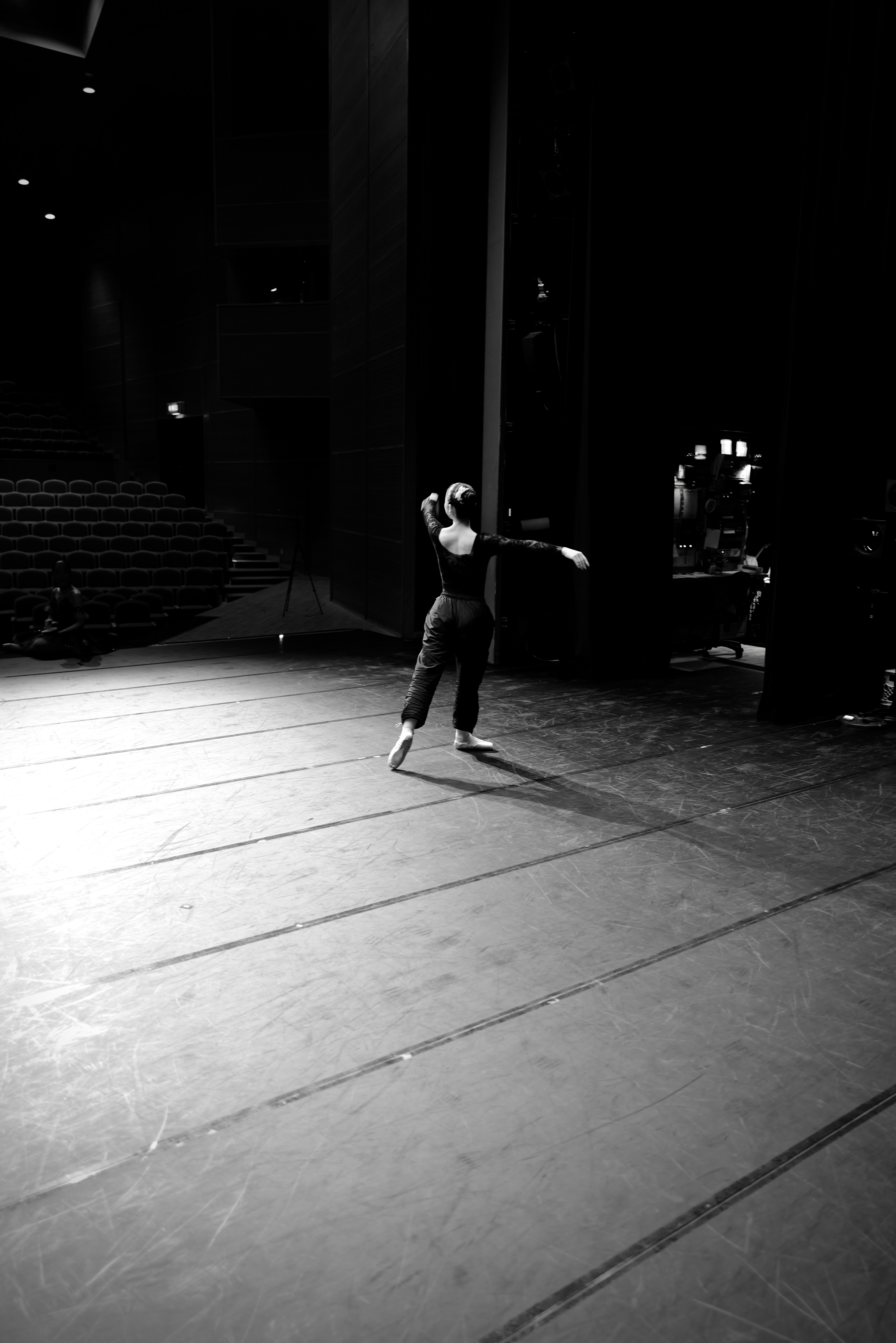 Dance on Stage: A Solo Rehearsal in a Dim Theatre
