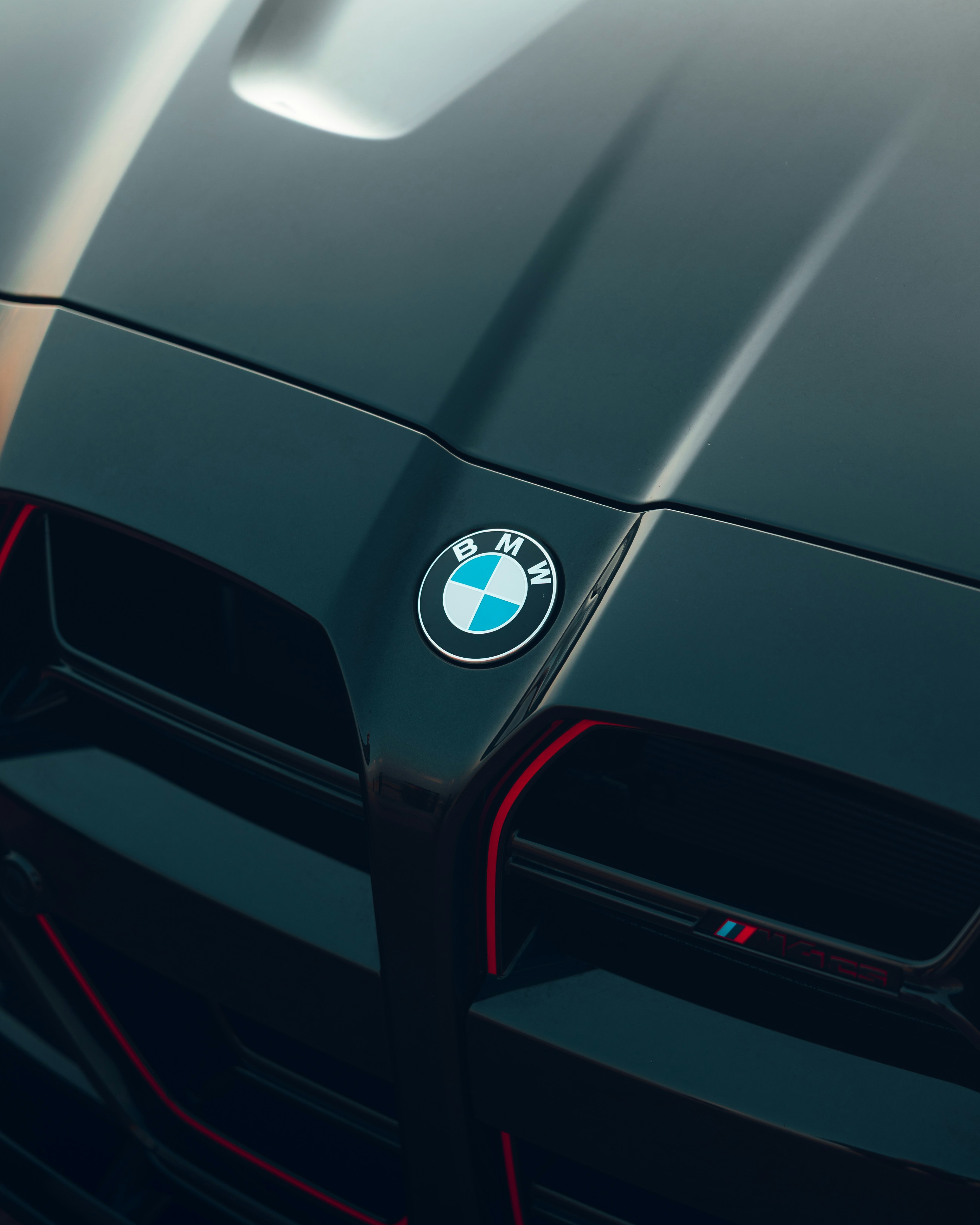 BMW emblem in armor: front and center of a dark BMW M power hood