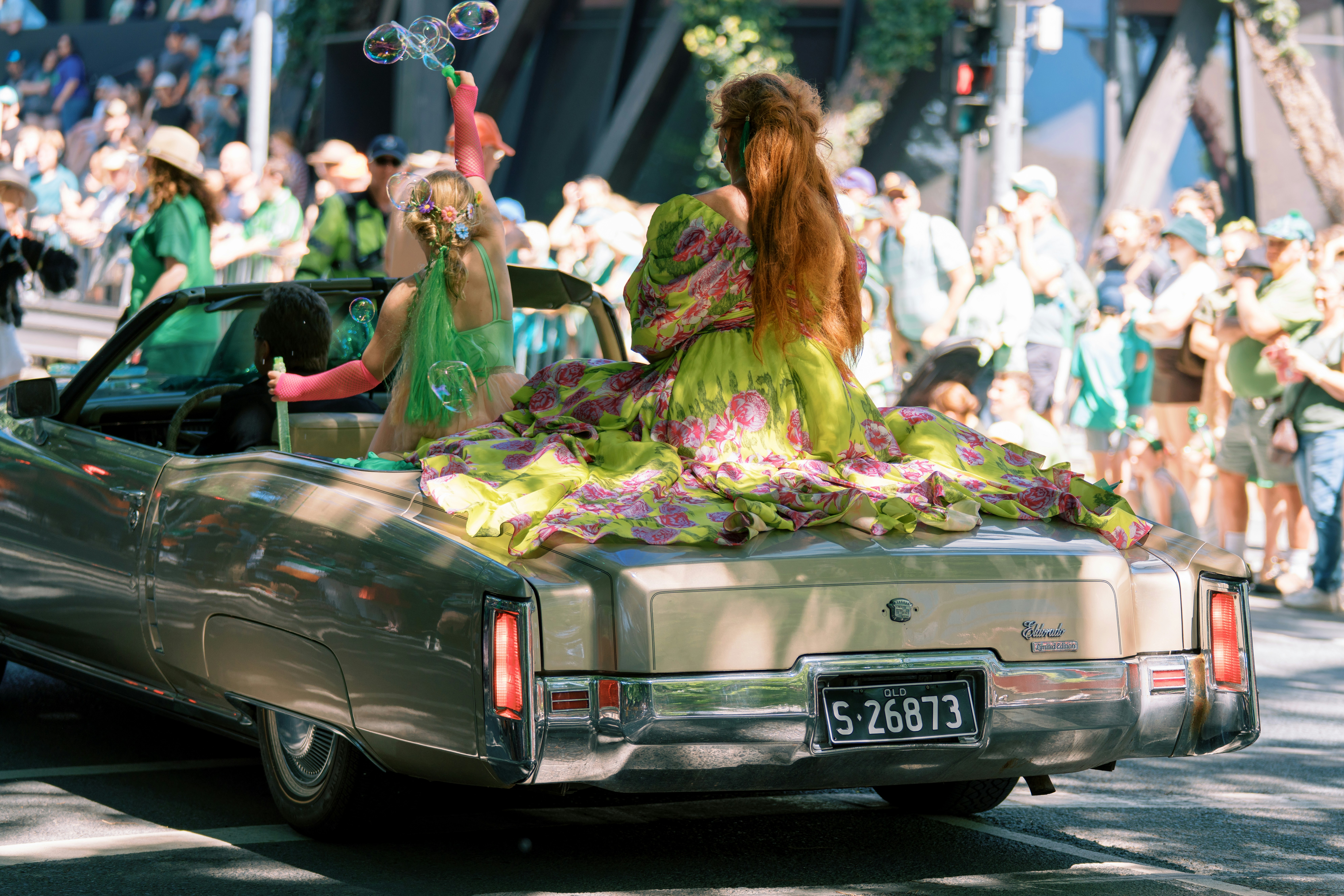 Glamour on a Convertible: Floats and Fans in the Parade