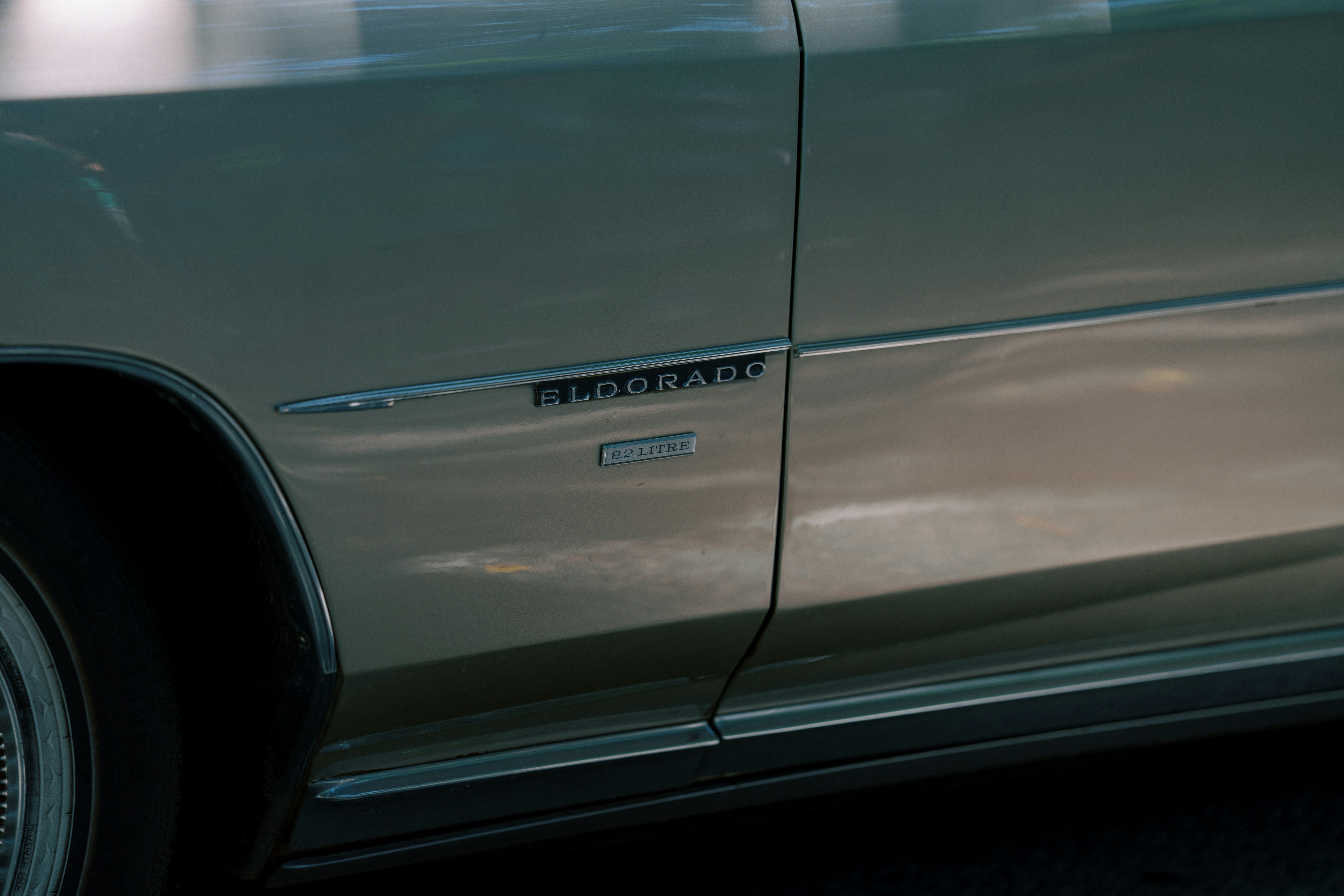 Chrome Badge on a Vintage Emerald Side Panel