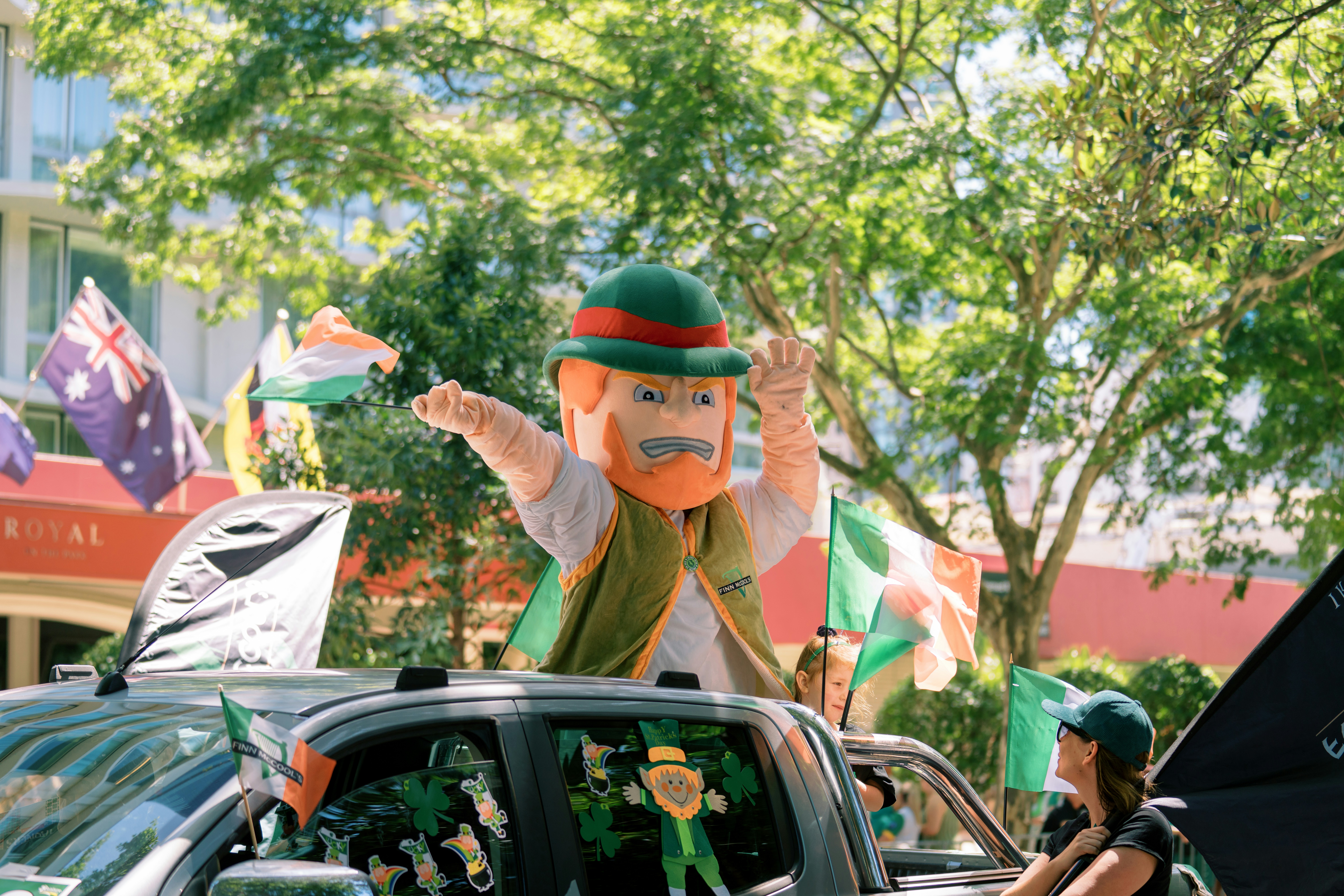 Mascot Parade Over the Hood: Cheer and Flags at Dawn