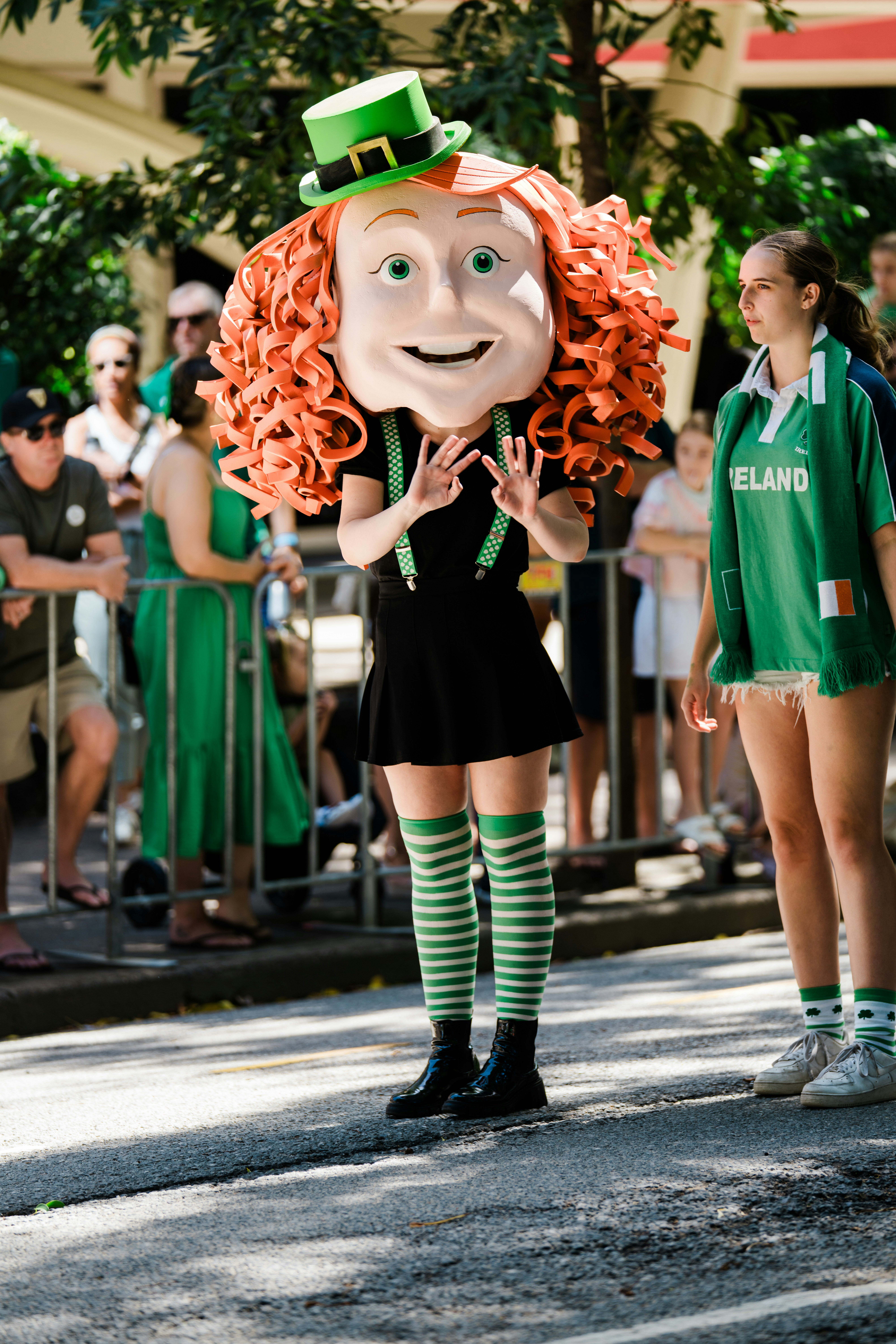 Emerald Parade Mascot: A Glorious Harlequin Head in a Crowded Street