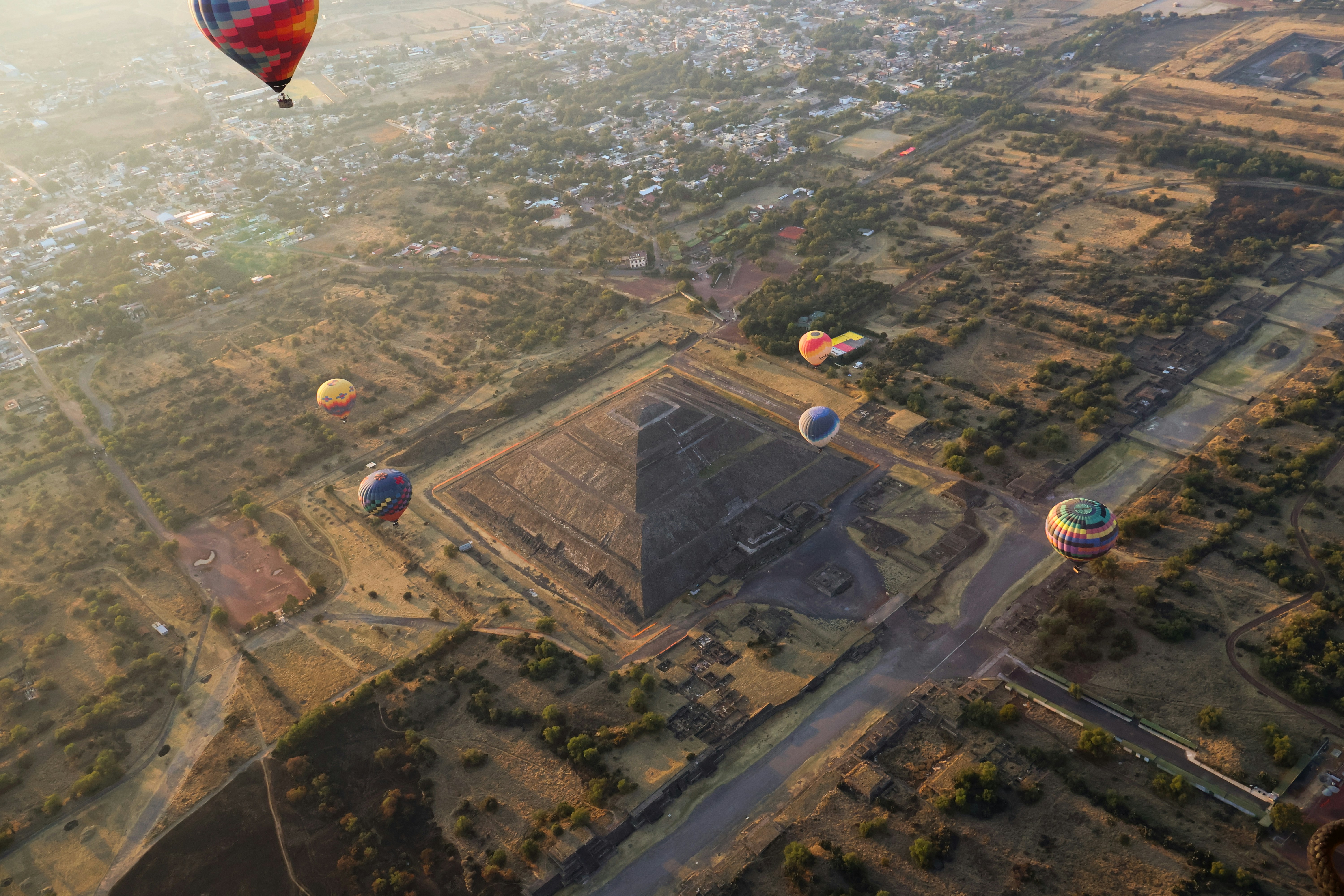 Aerial Tea Garden: Balloons Above an Ancient Pyramid