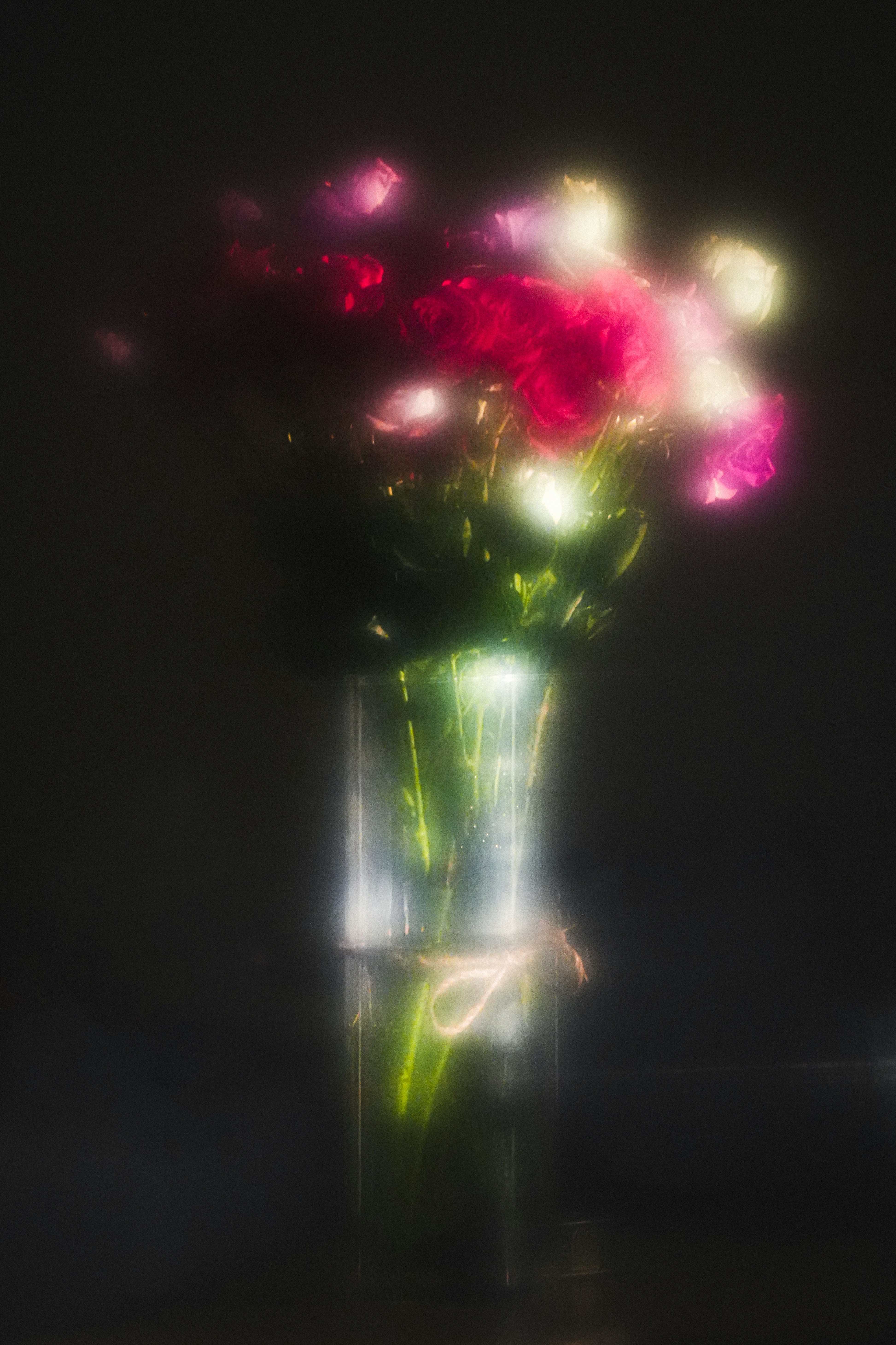 Glowing Bouquet in a Shadowed Glass
