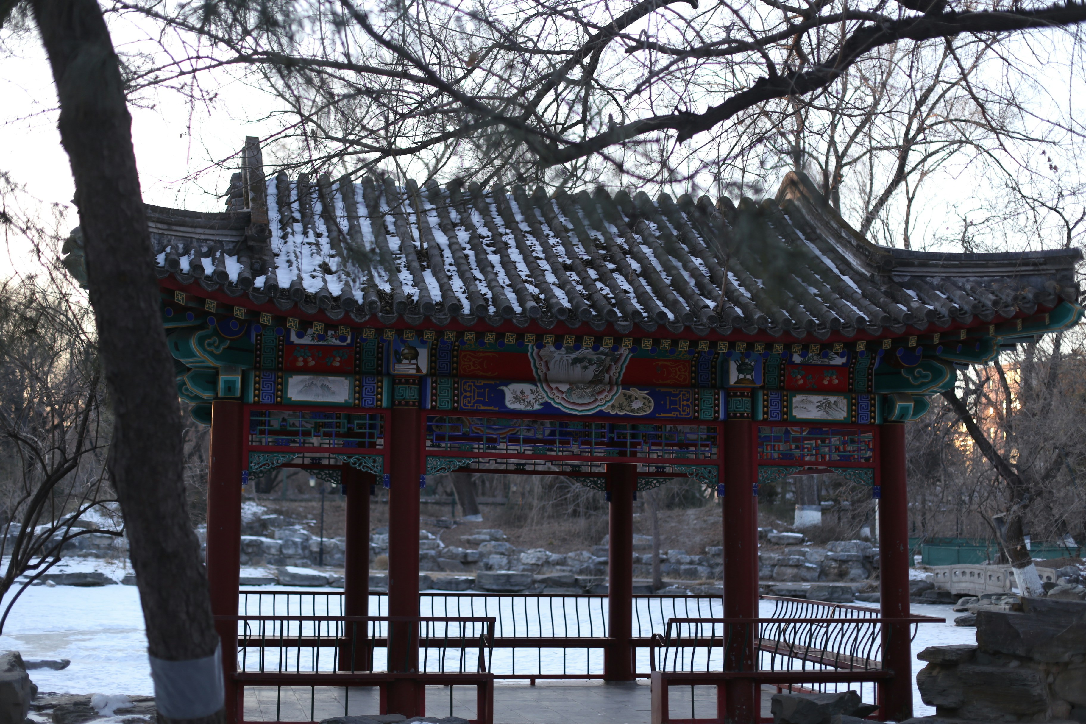 Red pavilion in a quiet winter garden