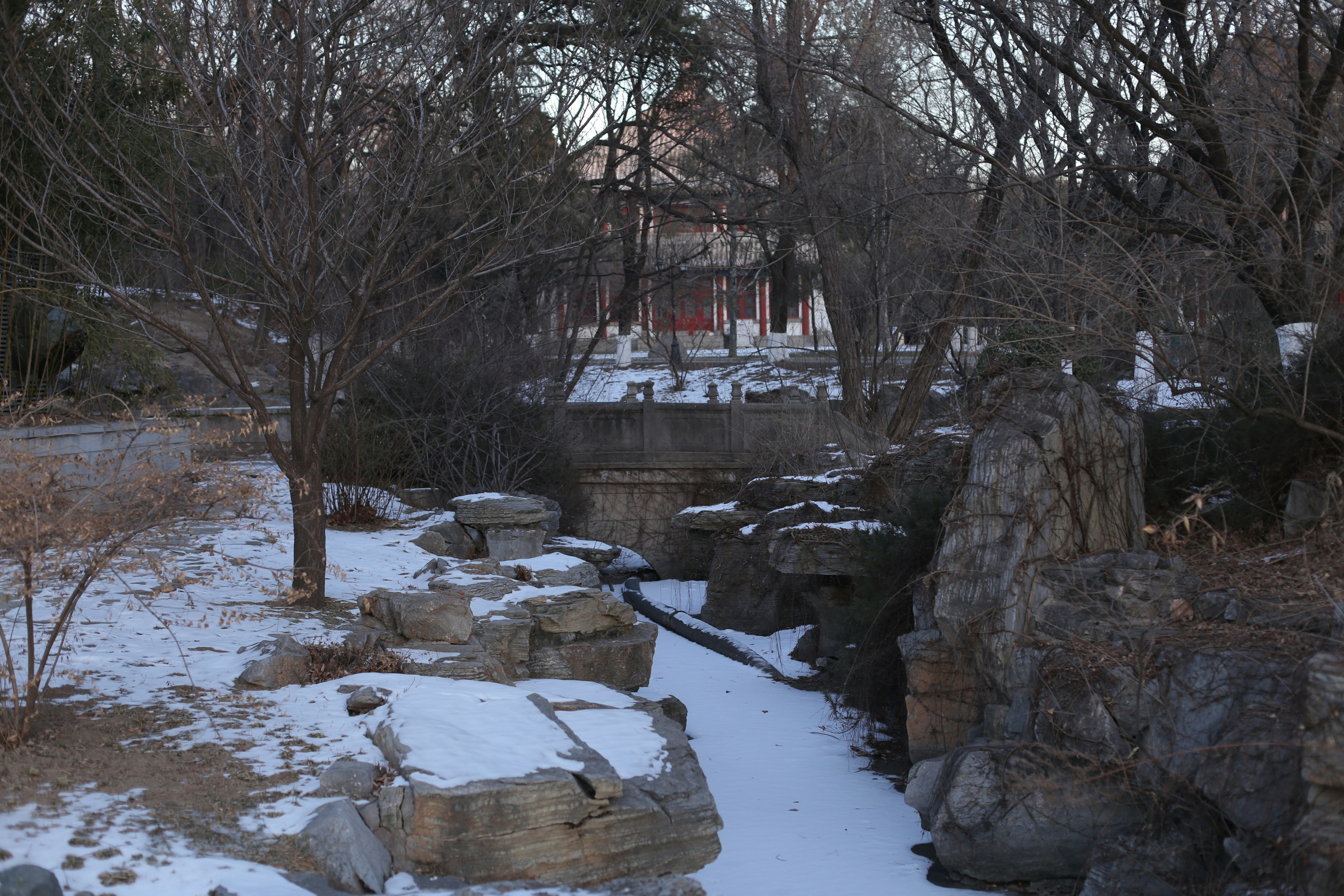 Winter Transit Through Weathered Stone and Snow