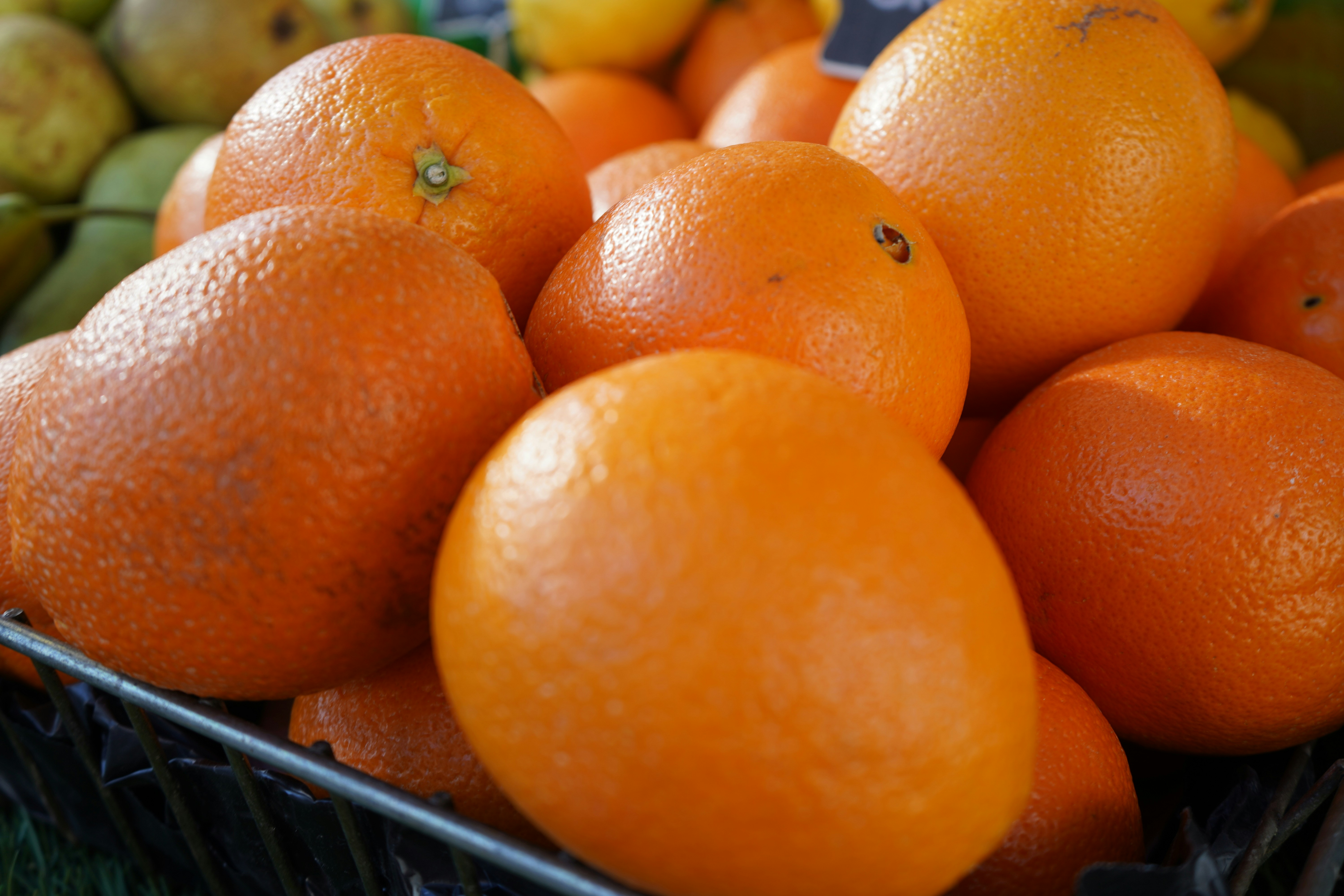 Sun-kissed Oranges in a Black Crate