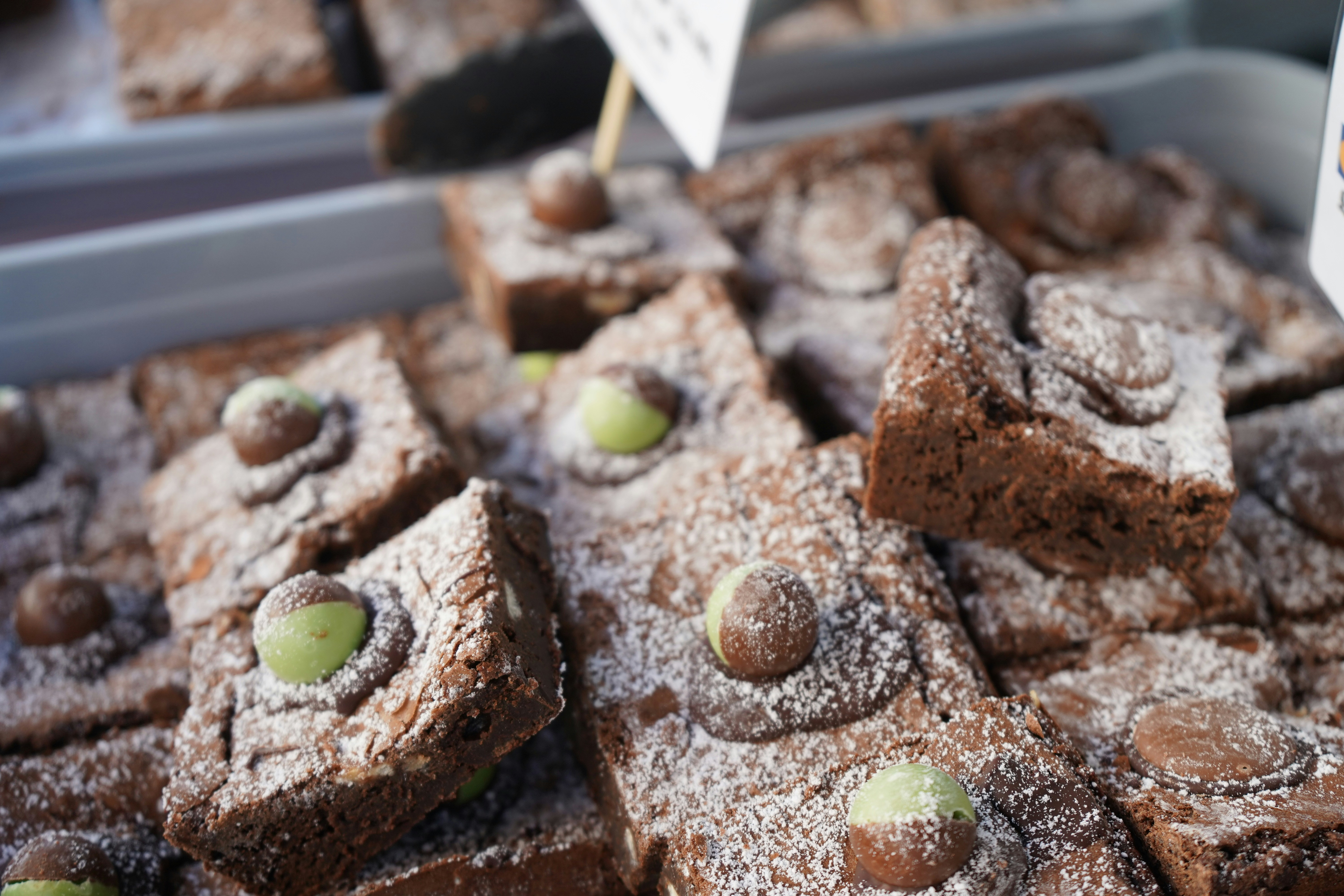 Powdered Chocolate Squares with Green-Studded Centers