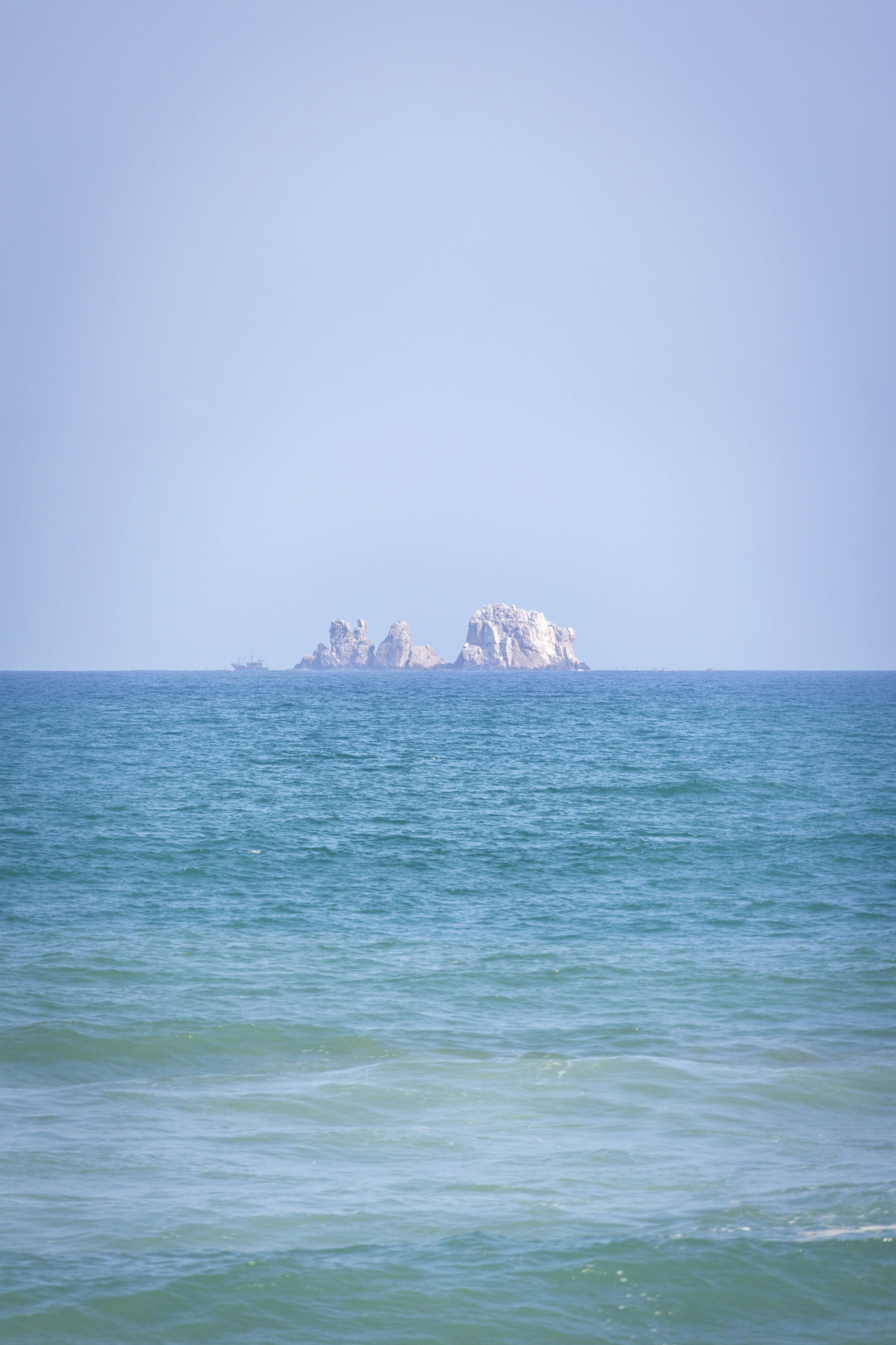 Isolated Sea Stack on a Calm Horizon