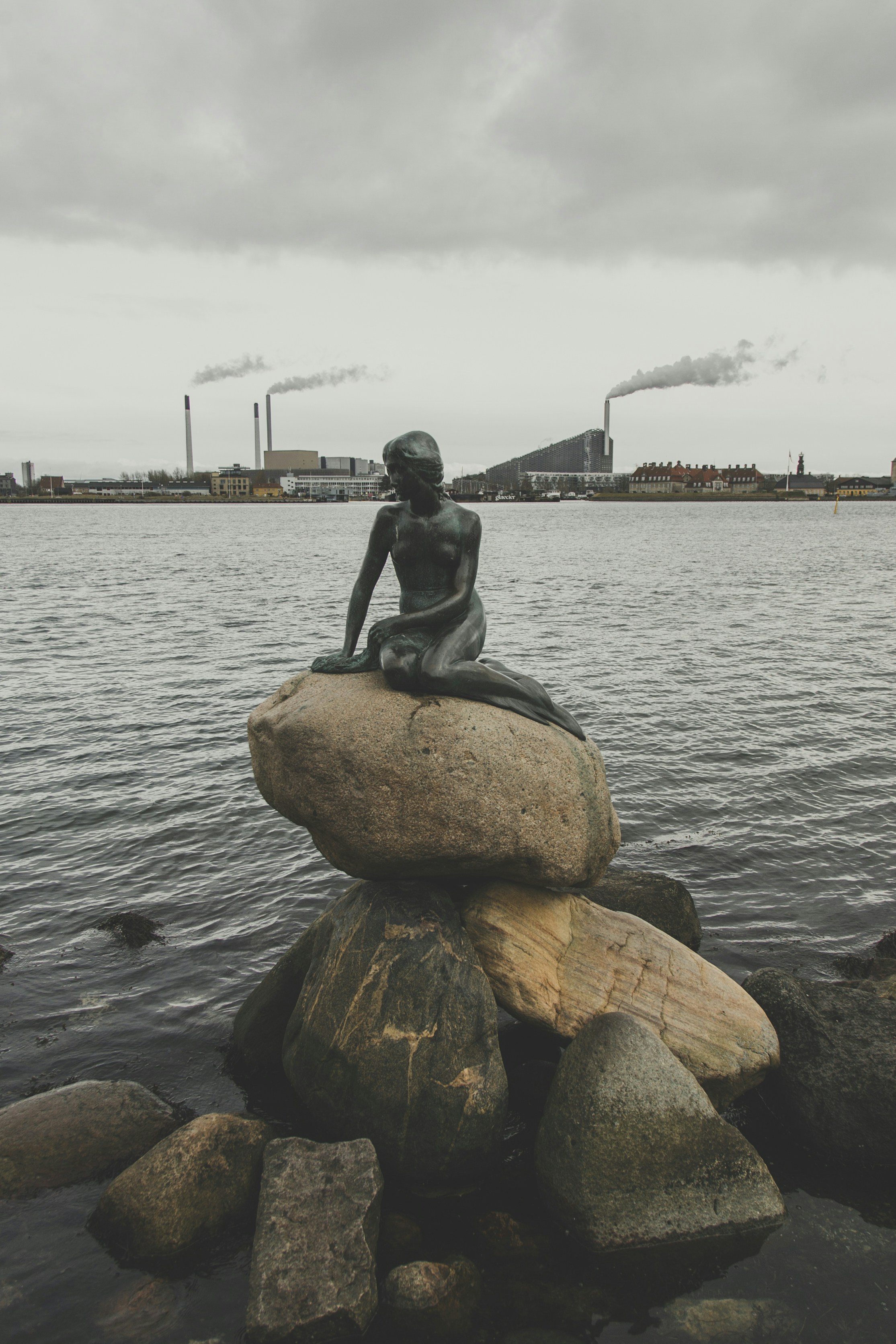 Sitting on Stone: A Bronze Mermaid Guarding the Harbor