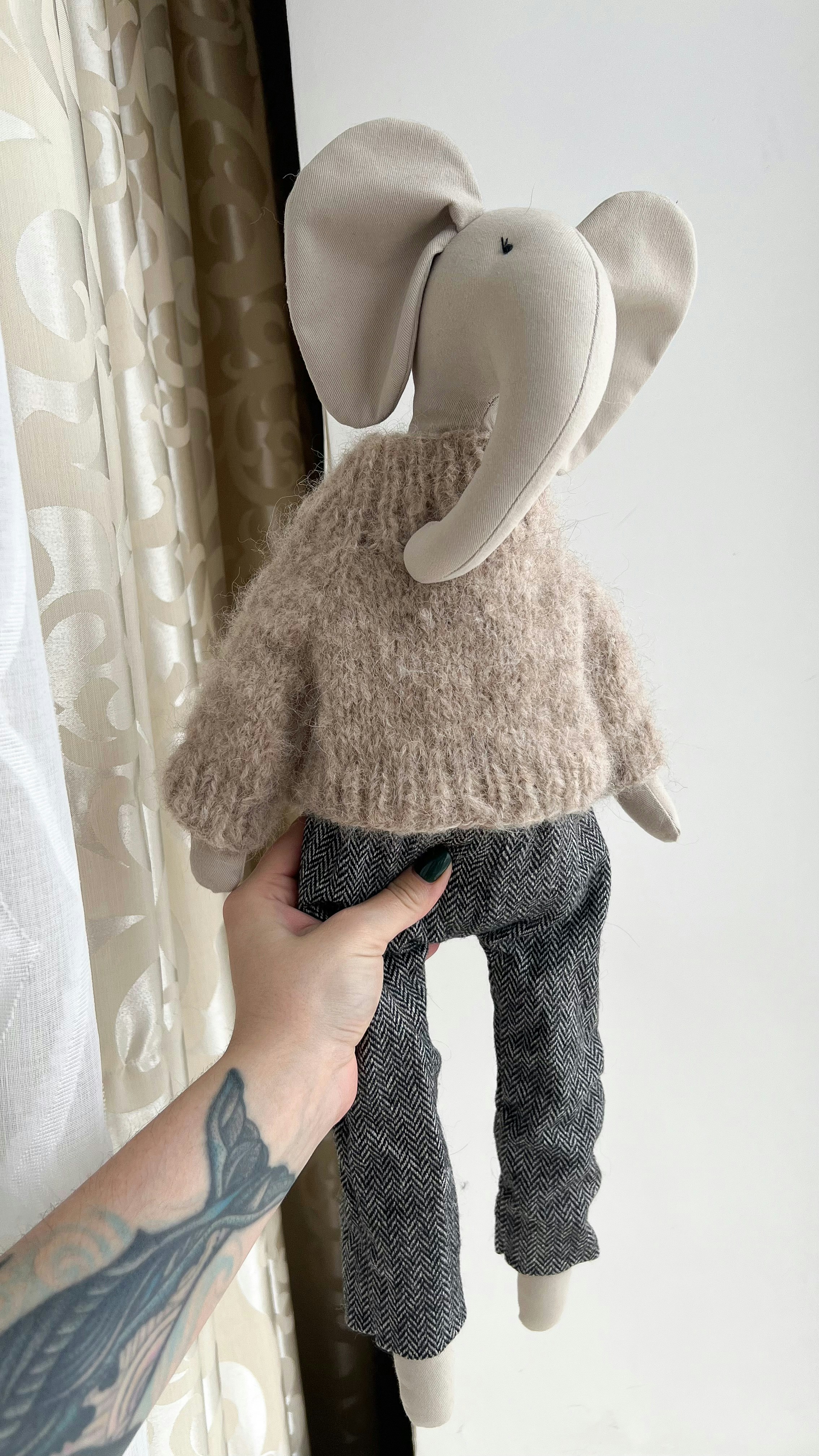 Hand-Held Plush Elephant: Cozy Woolen Sweater and Tailored Trousers
