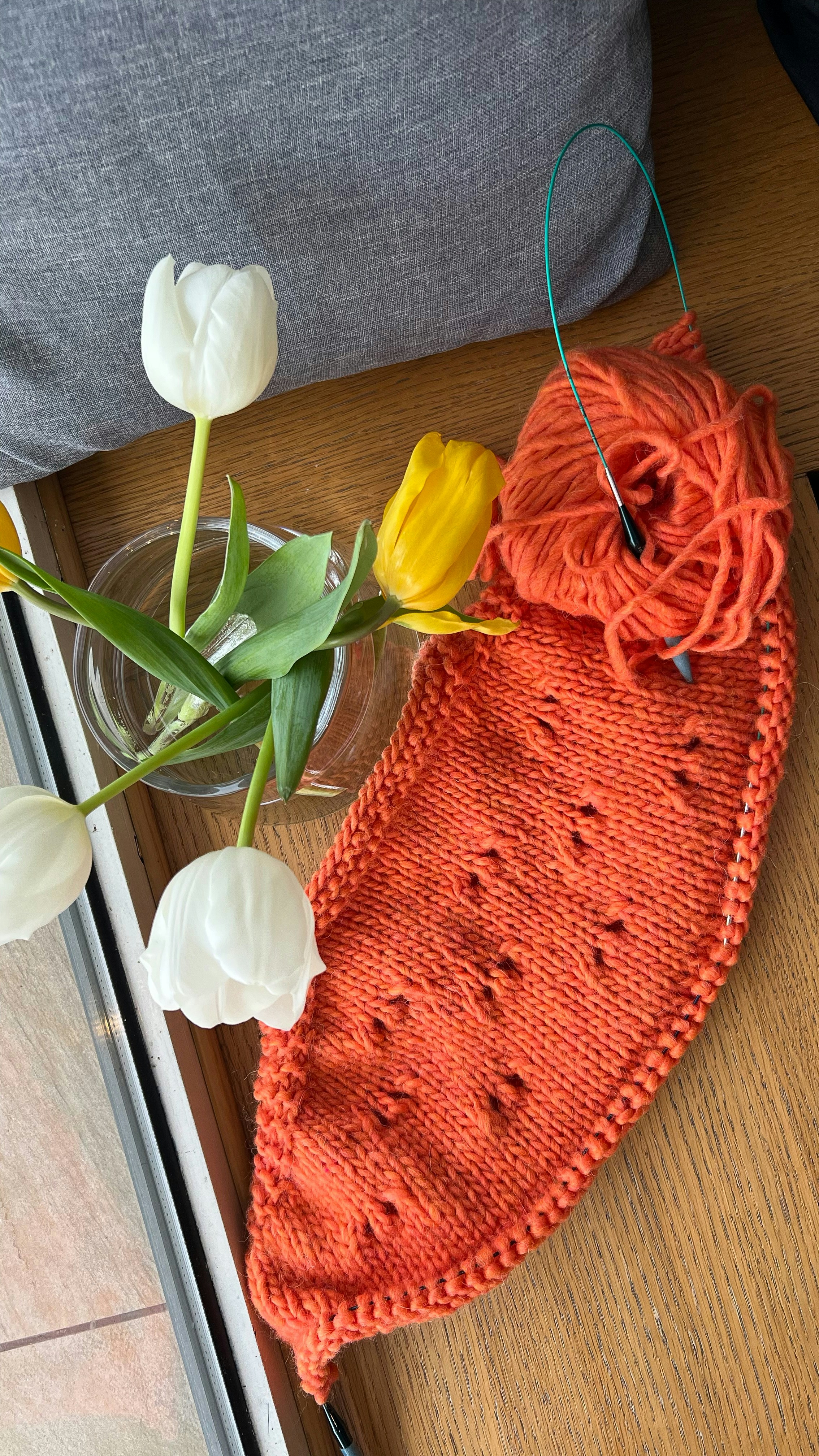 Orange Knit Slipper with White Tulips on a Window Bench