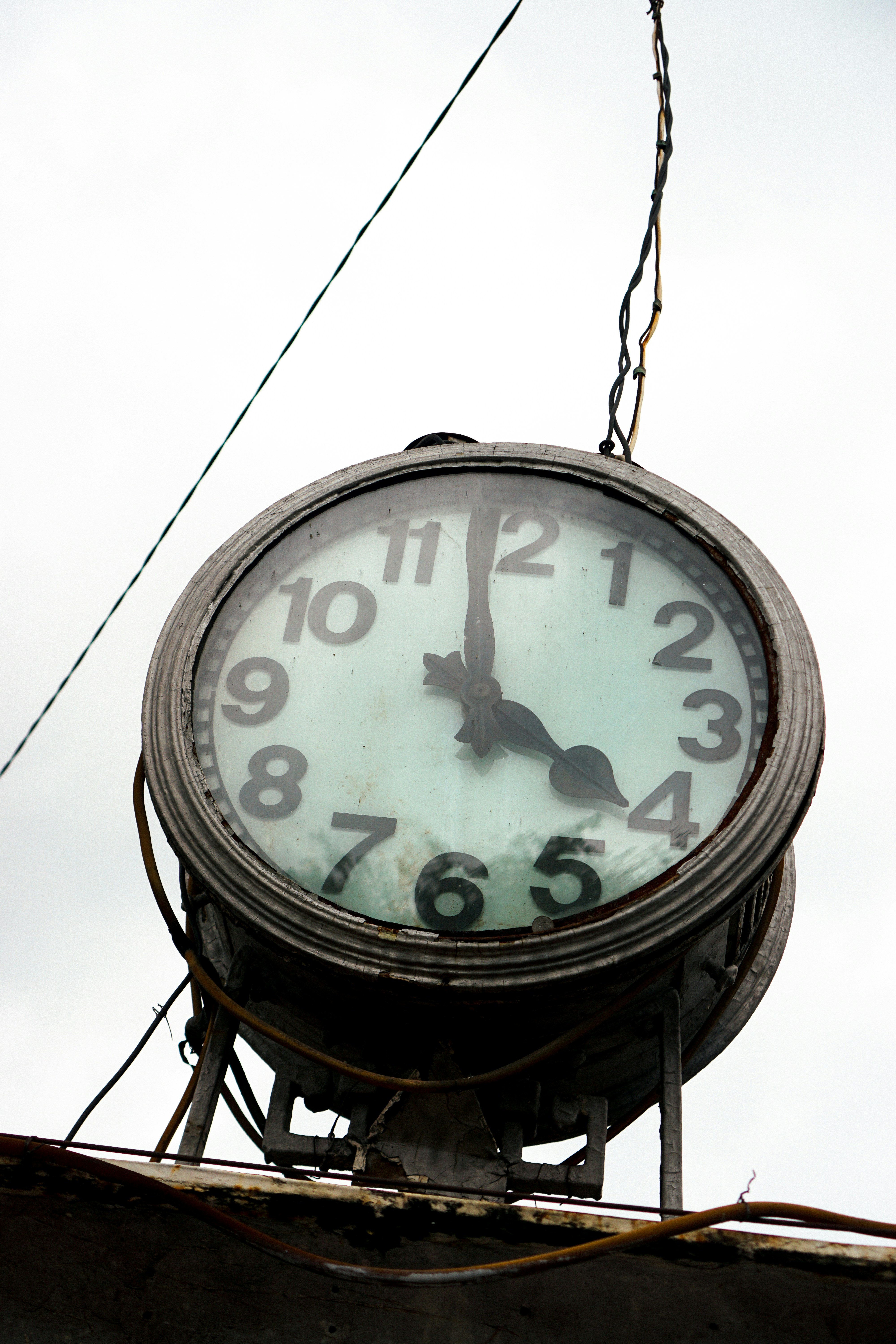 Timeless Gauge: The Hanging Clock Over Industrial Heath