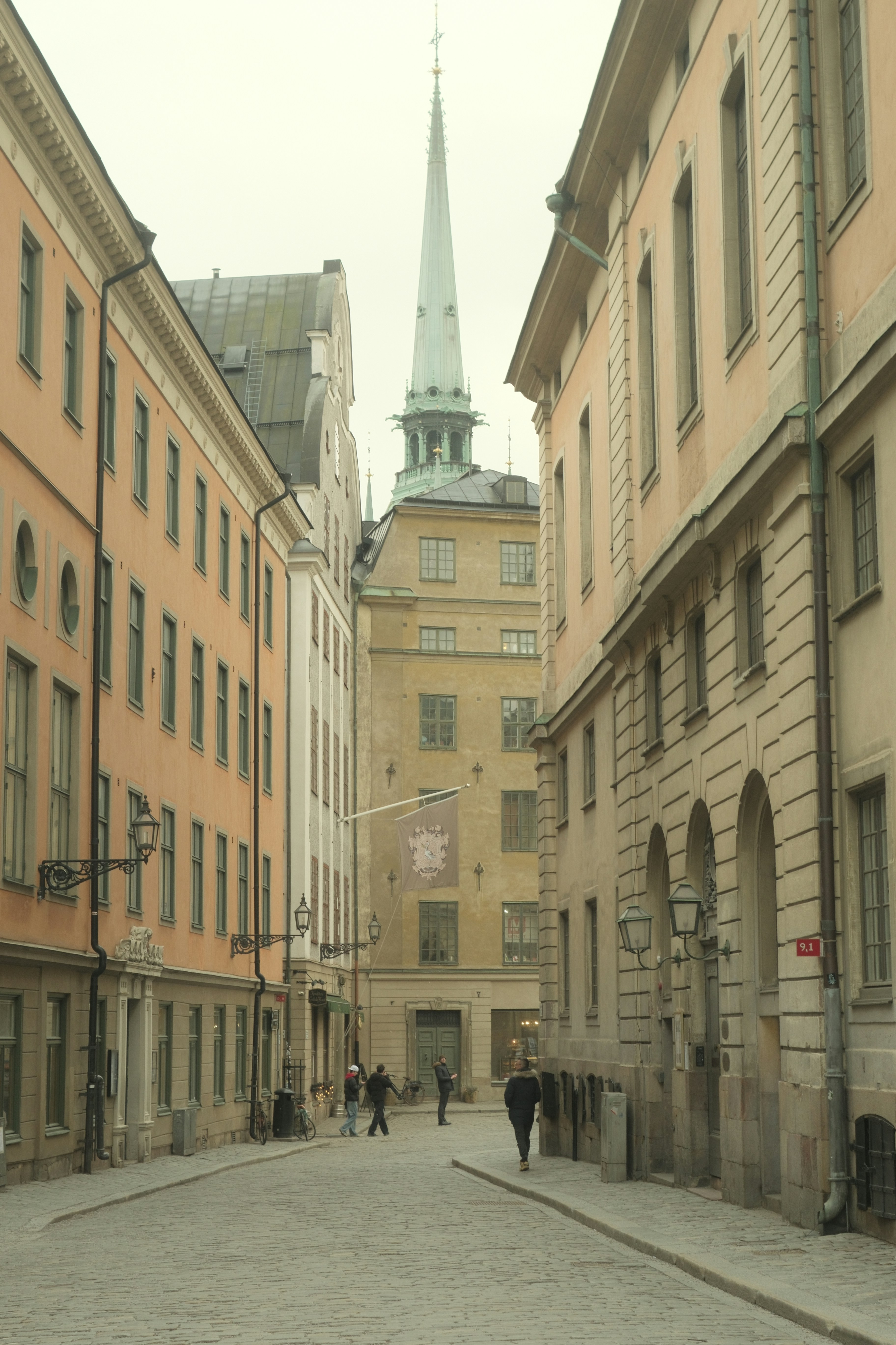 Cobbled Street Toward a Cathedral Spire