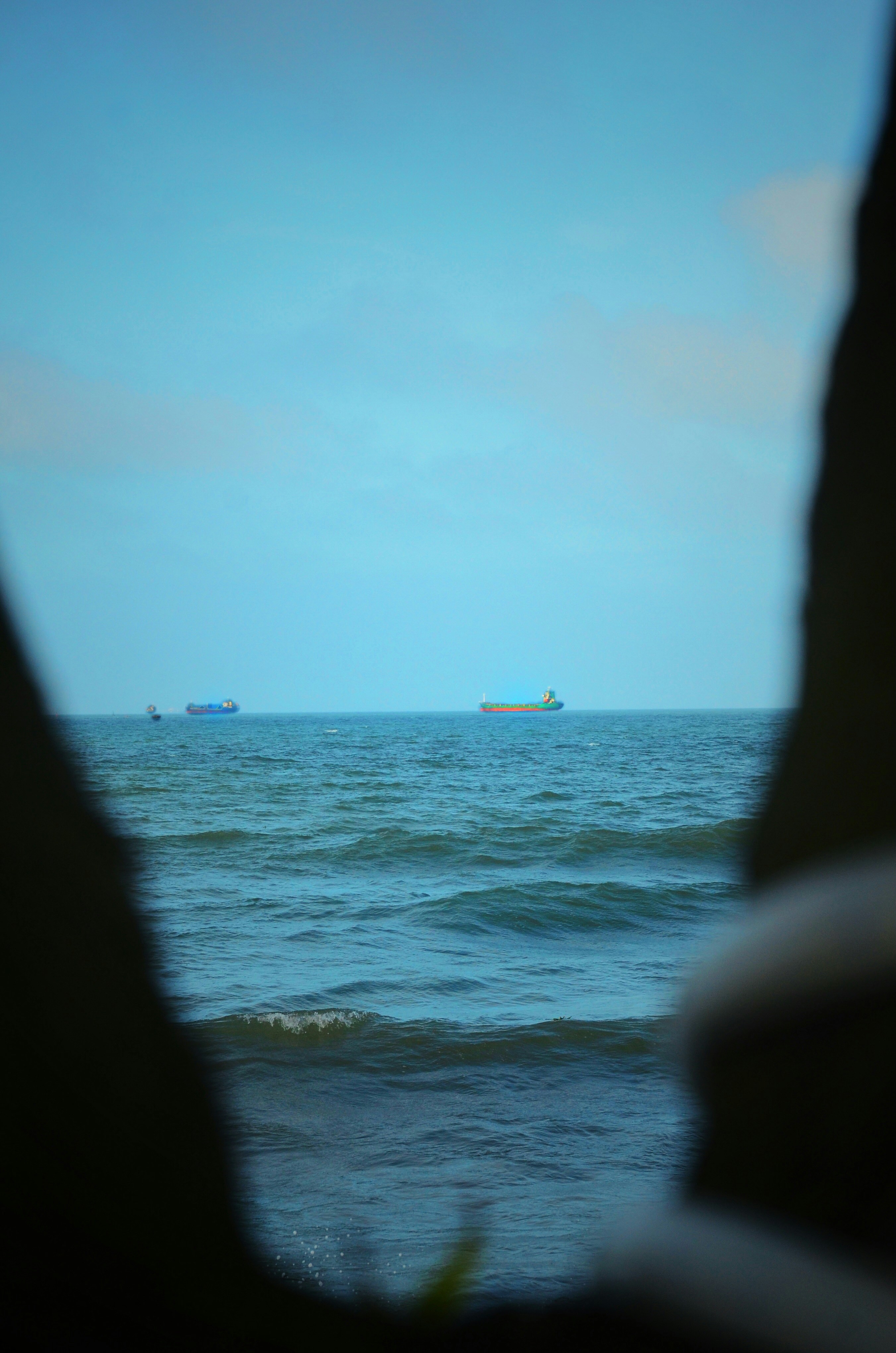 Horizon Between Rocks: Ships Whisper on the Blue