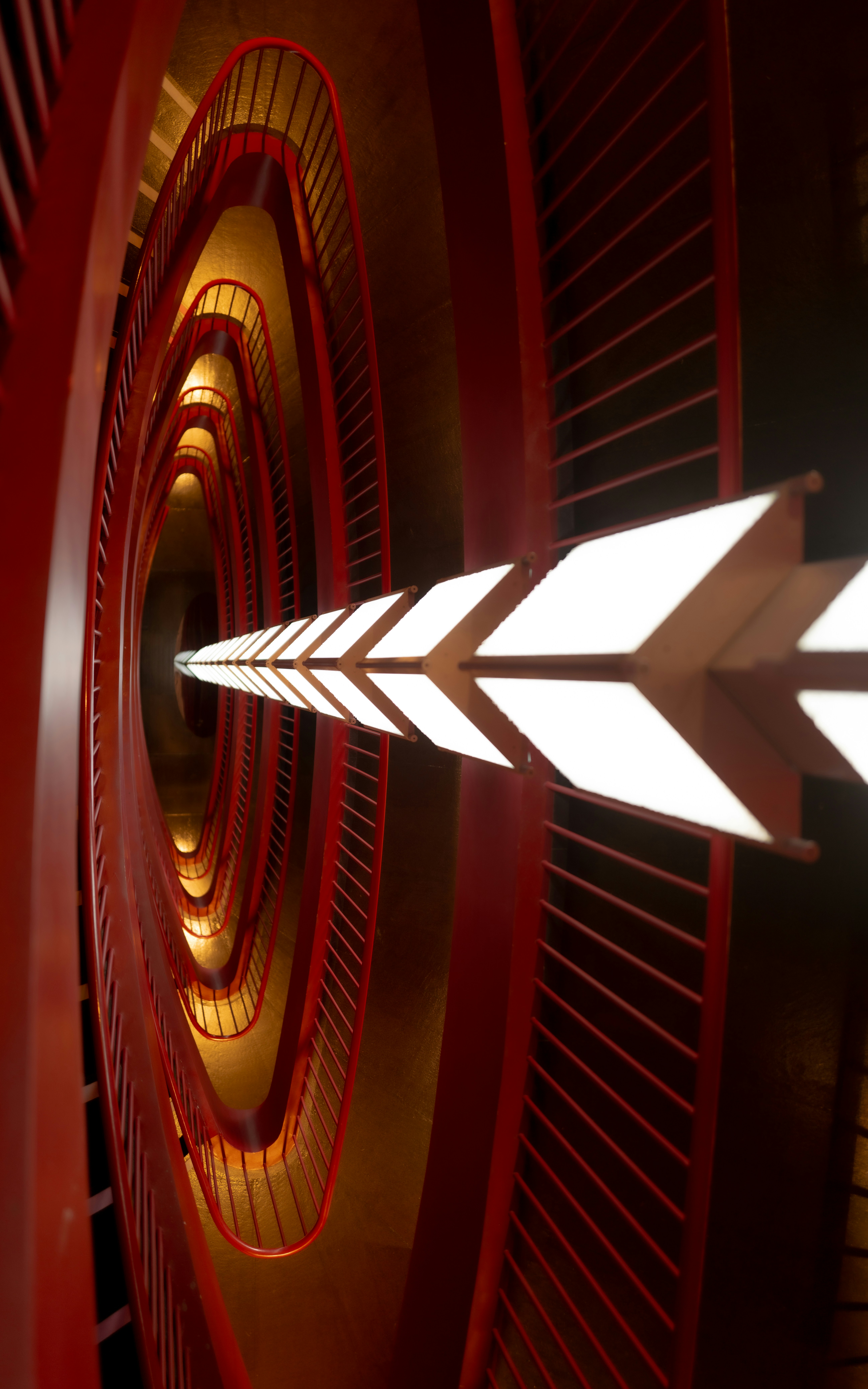 Red Helix: A Neon Staircase Reaches Toward the Light
