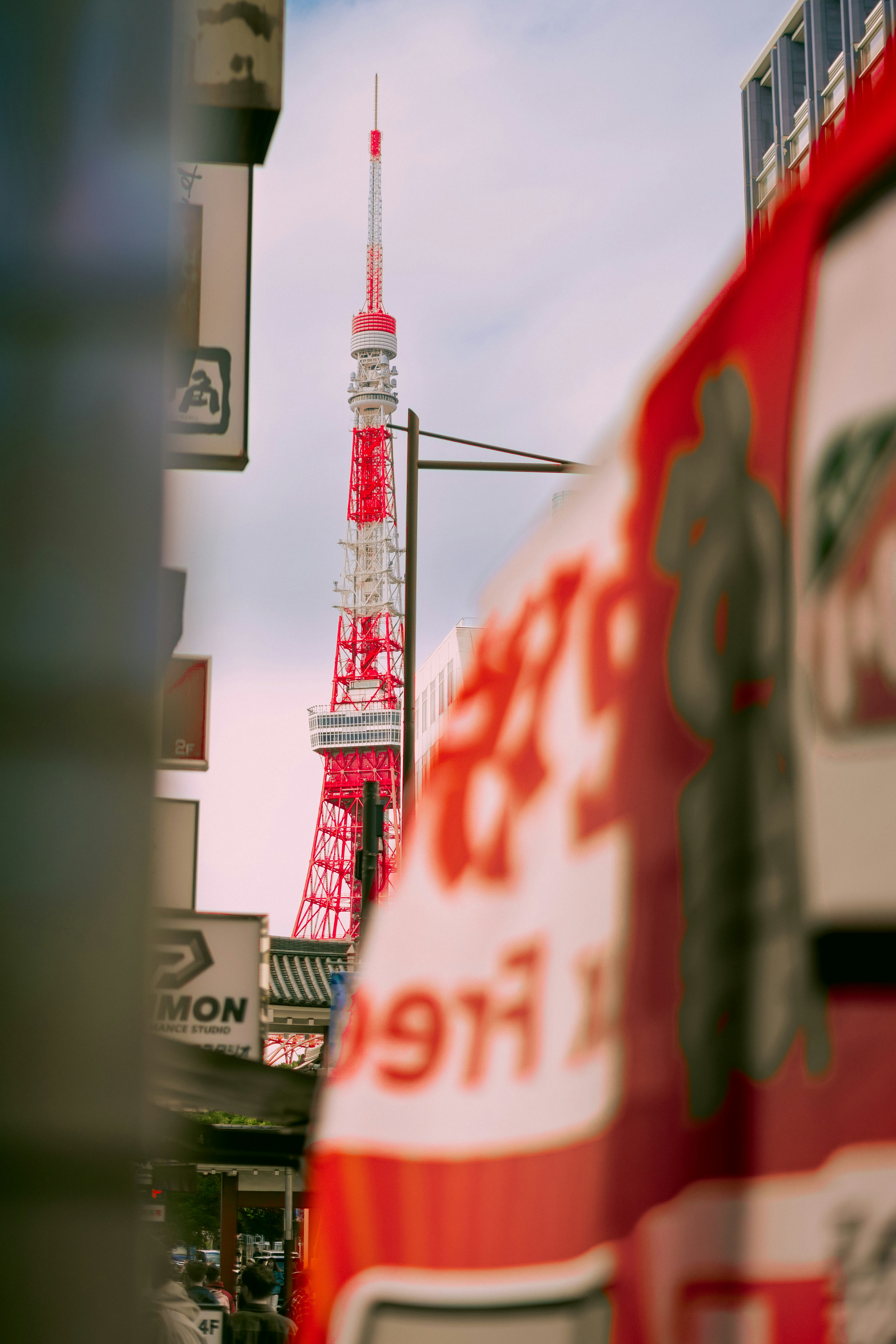 Tokyo Tower Pierced by Red Banners