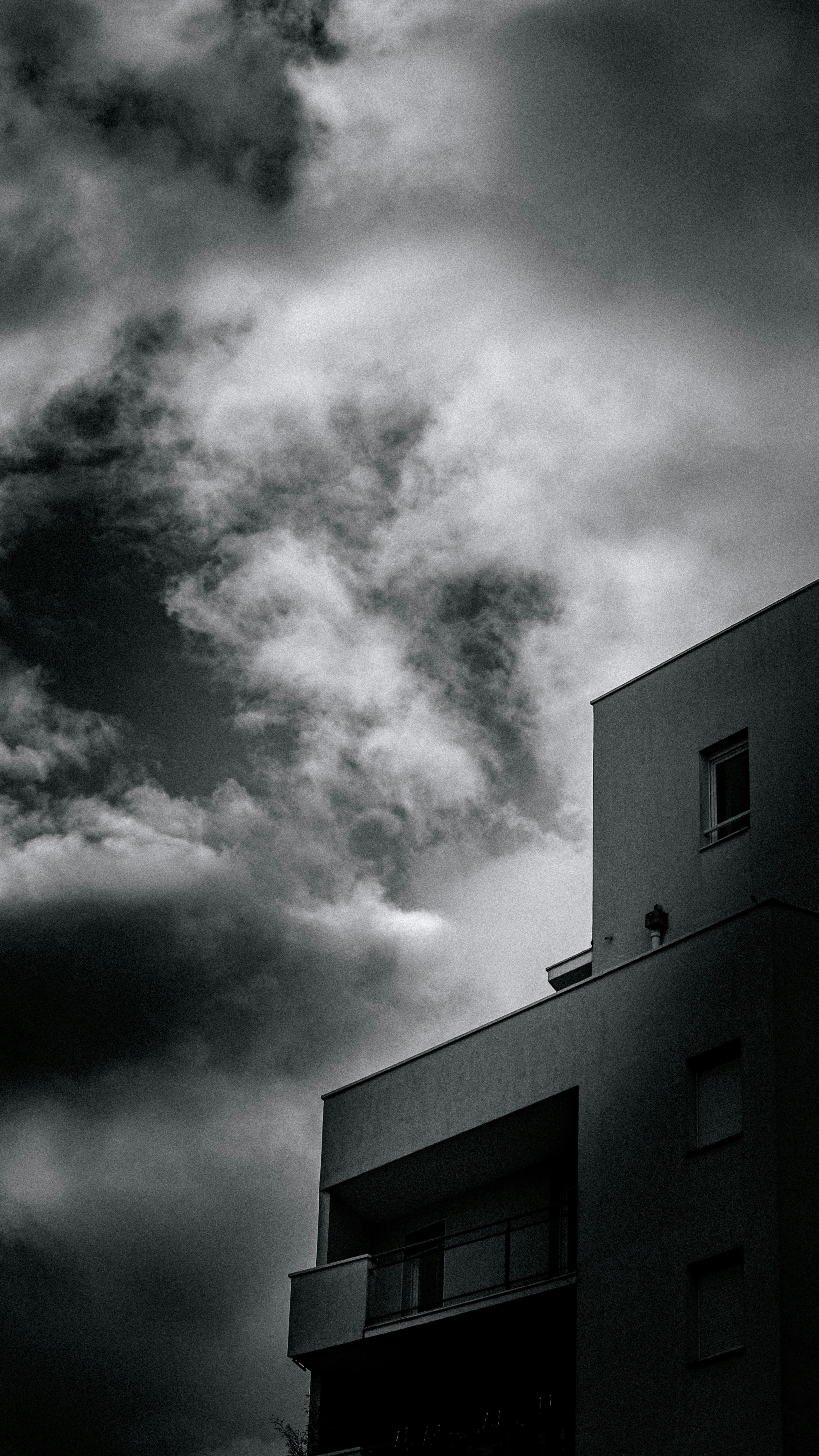 Urban Monolith Against a Tempest Sky