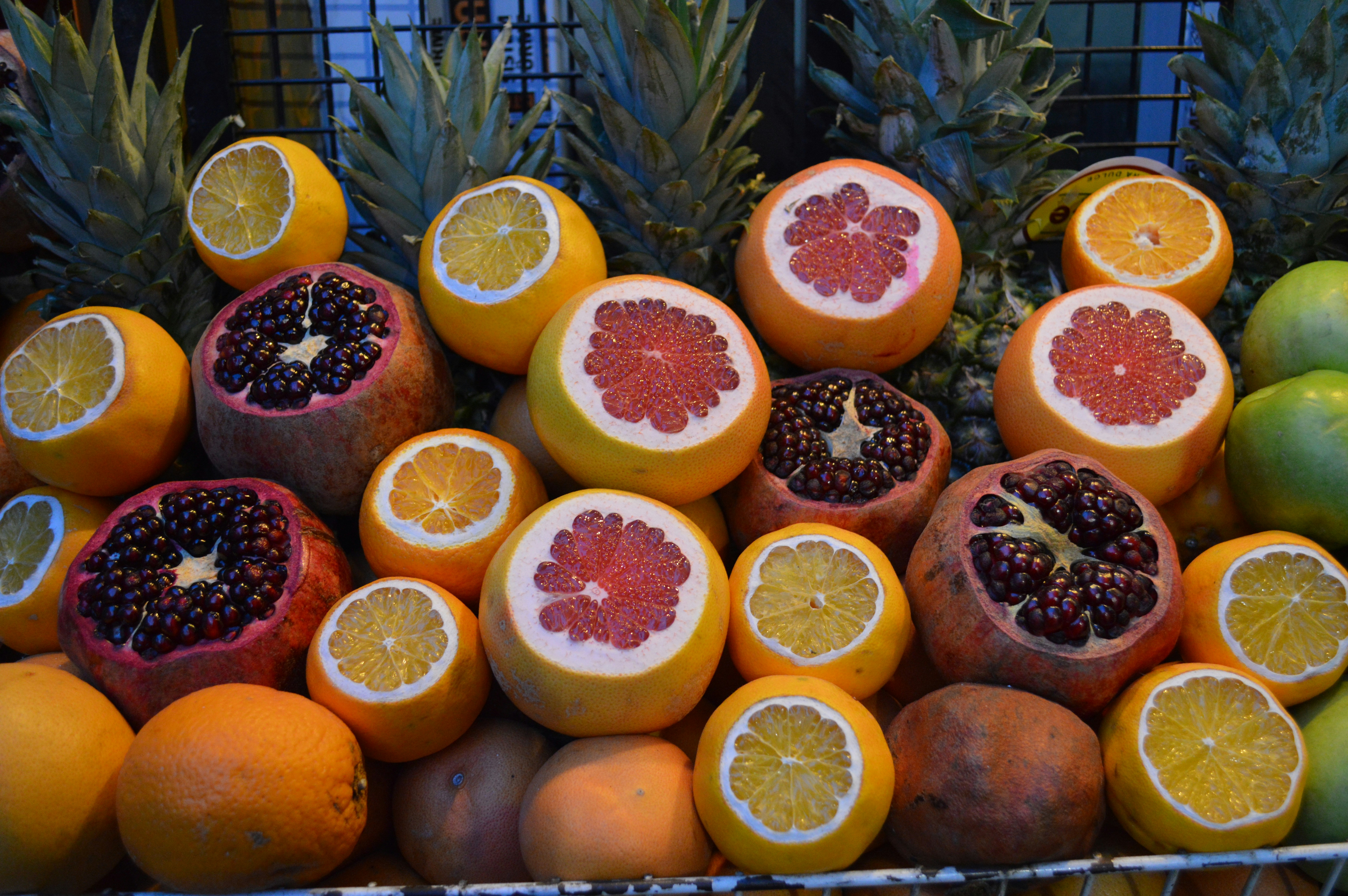 Citrus Mosaic: A Market of Halved Oranges and Pomegranate Gems