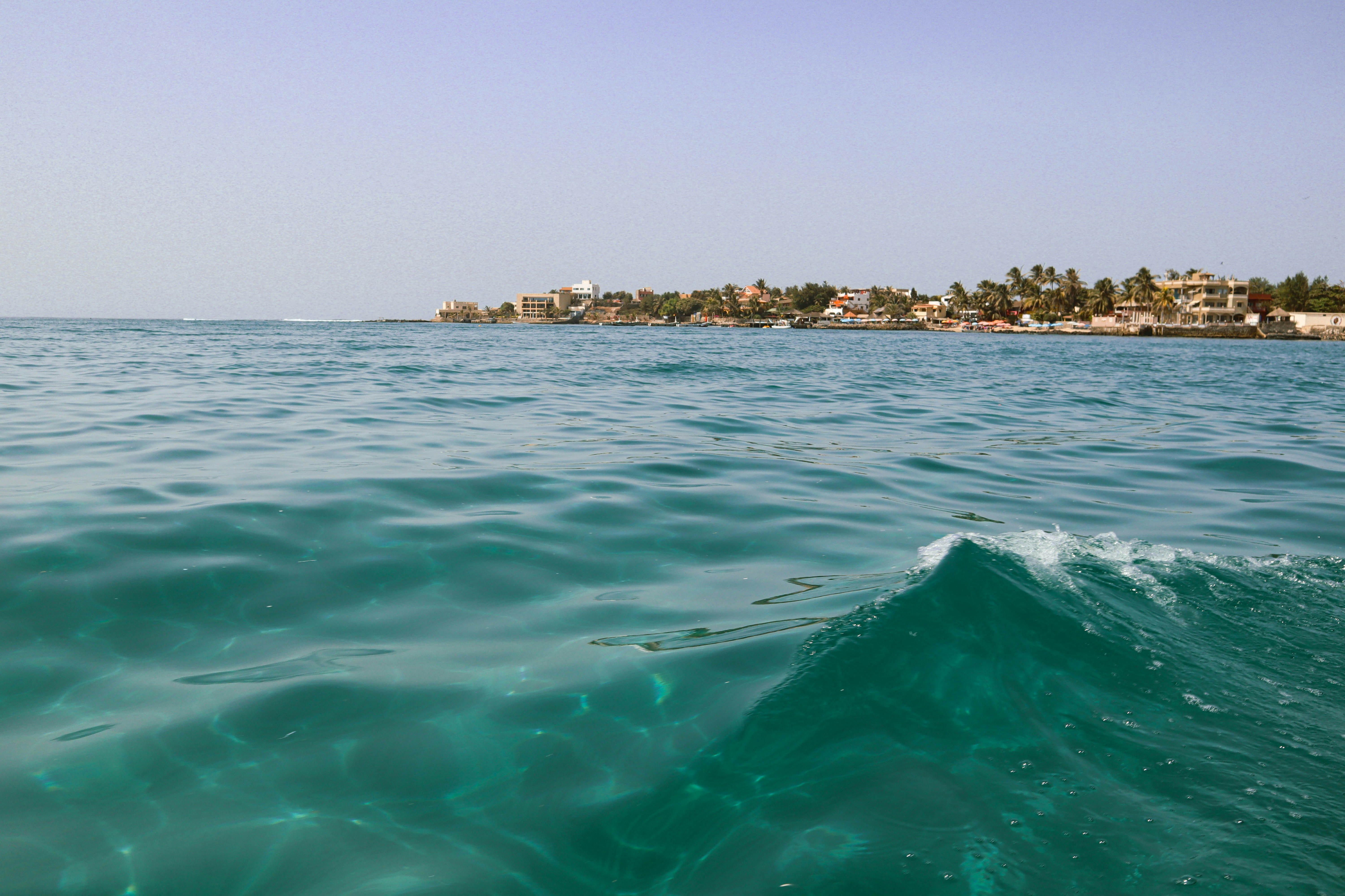 Coastal Calm: A Quiet Sea Meeting a Distant Shore