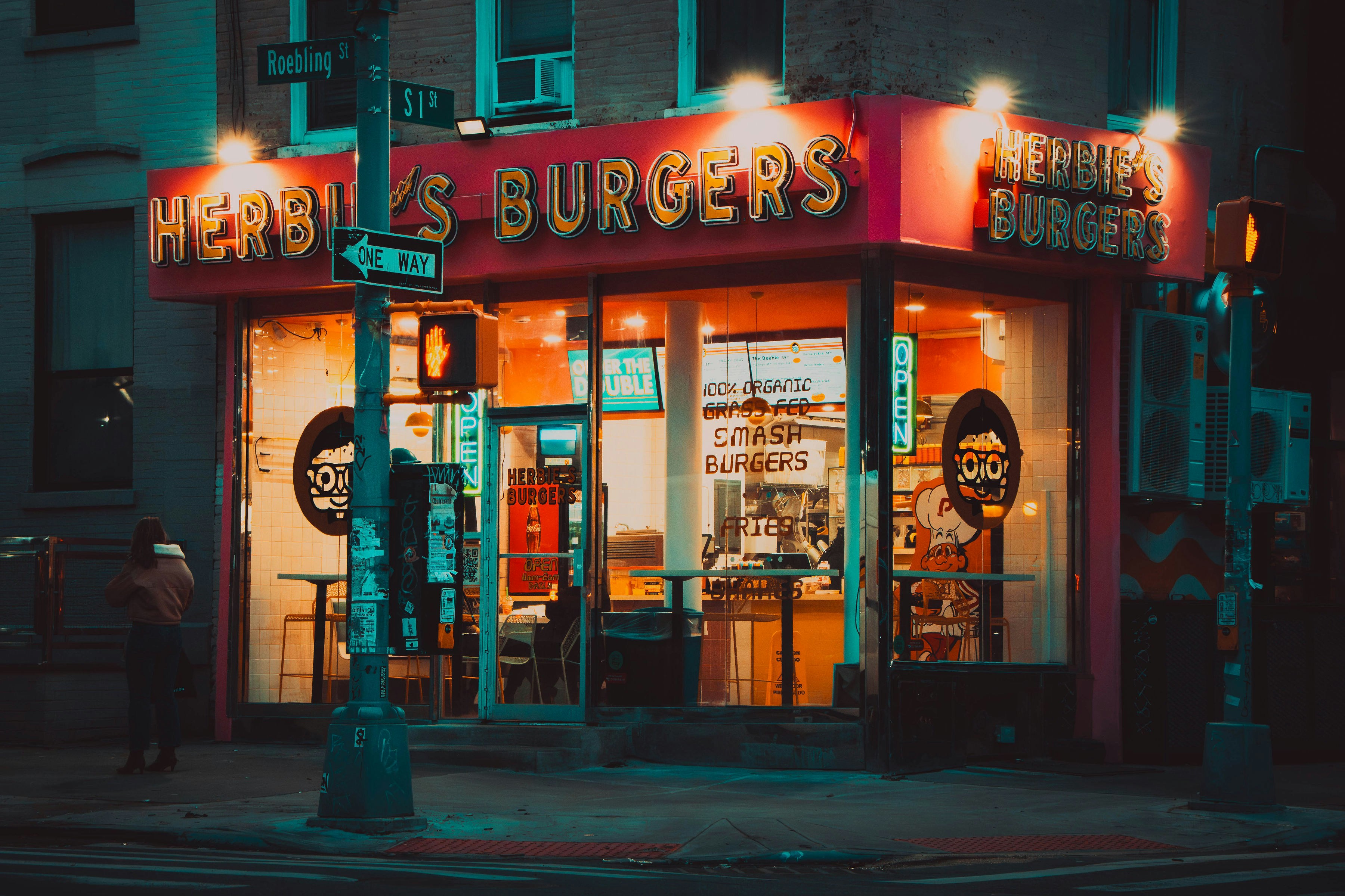 Neon Corner: A late-evening burger joint glowing in red and teal